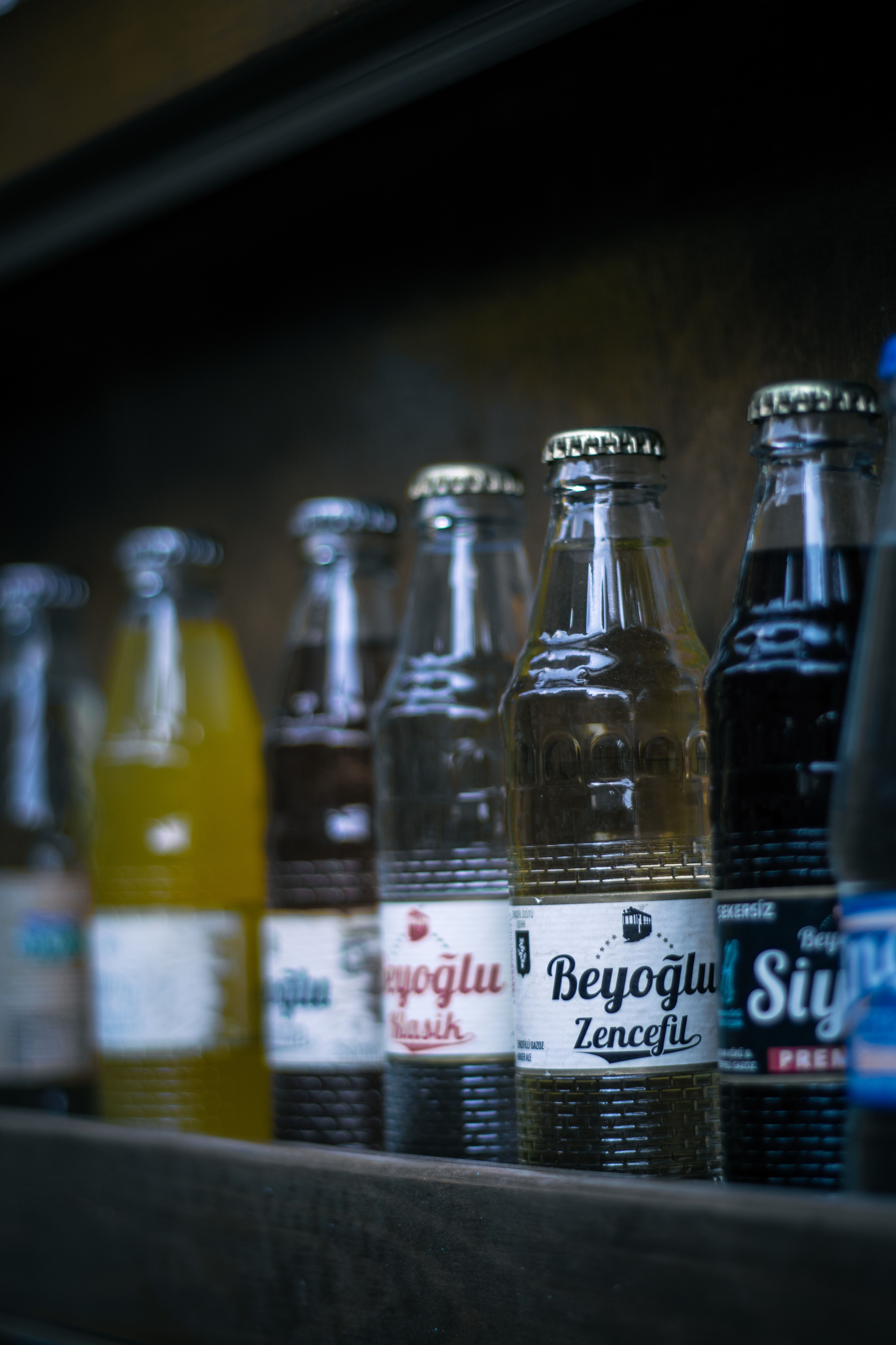 Closeup of Bottled Drinks on a Shelf · Free Stock Photo