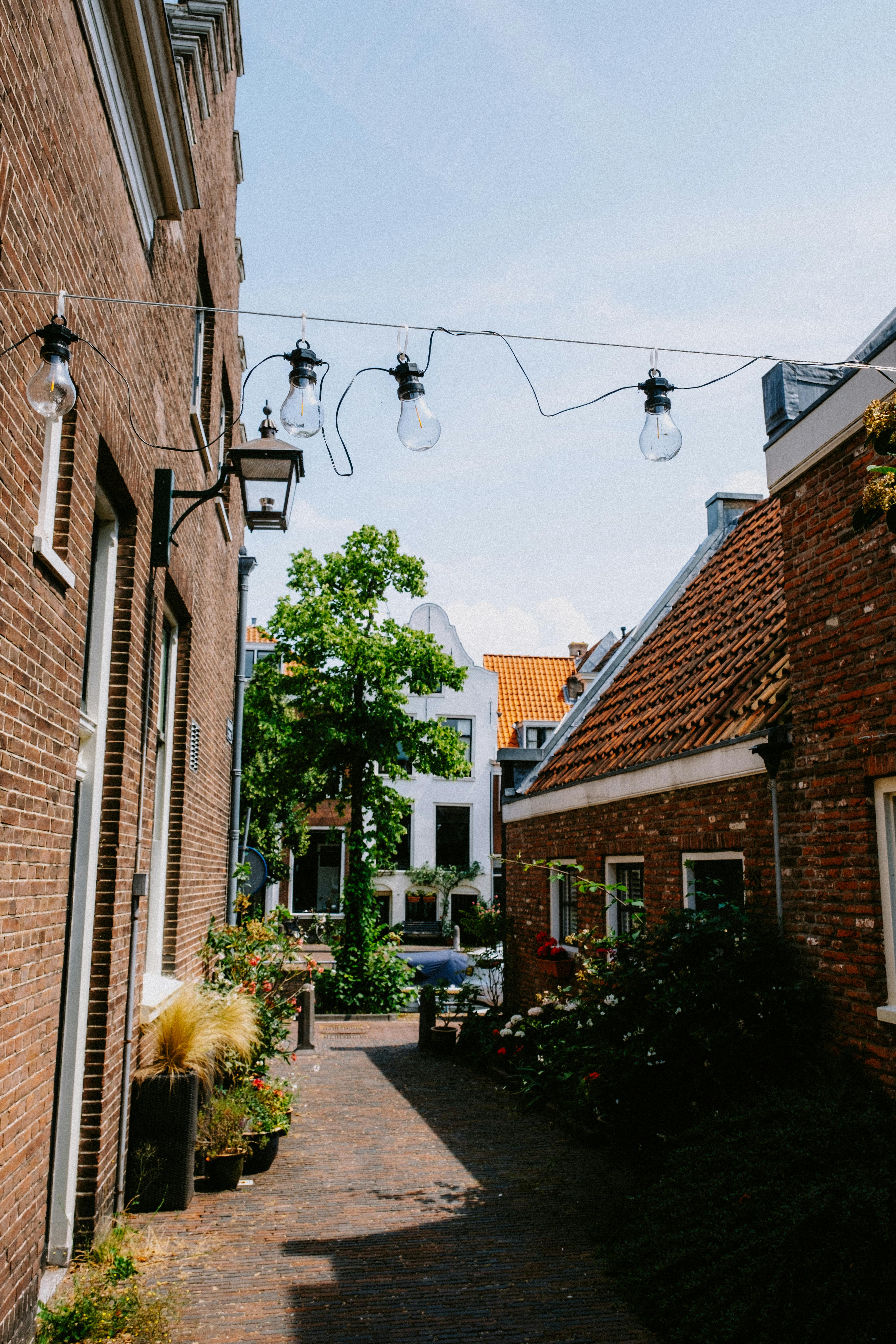 Street in between Brick Buildings · Free Stock Photo