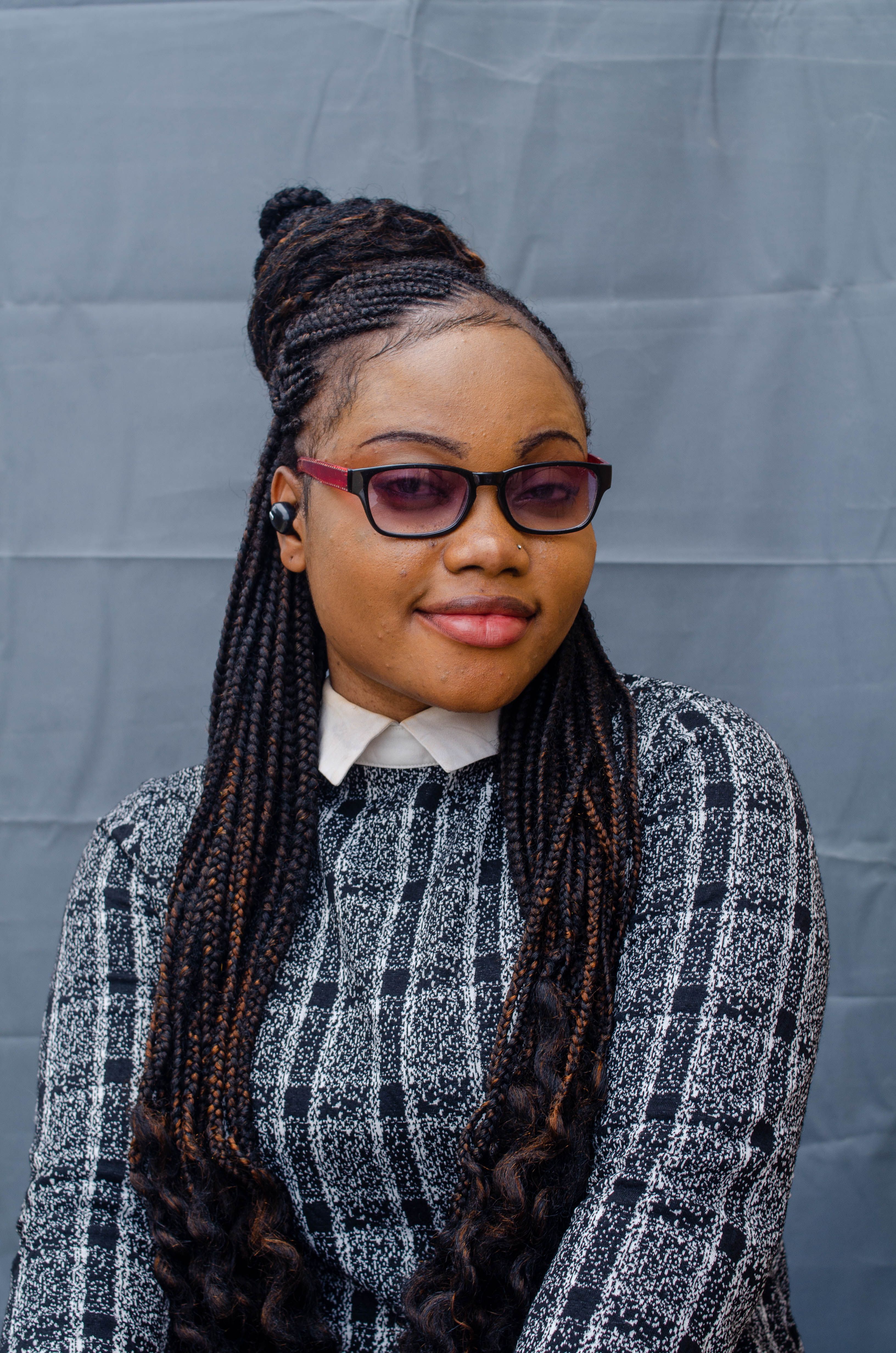 Portrait of Young Woman with Dreadlocks Wearing Glasses · Free Stock Photo