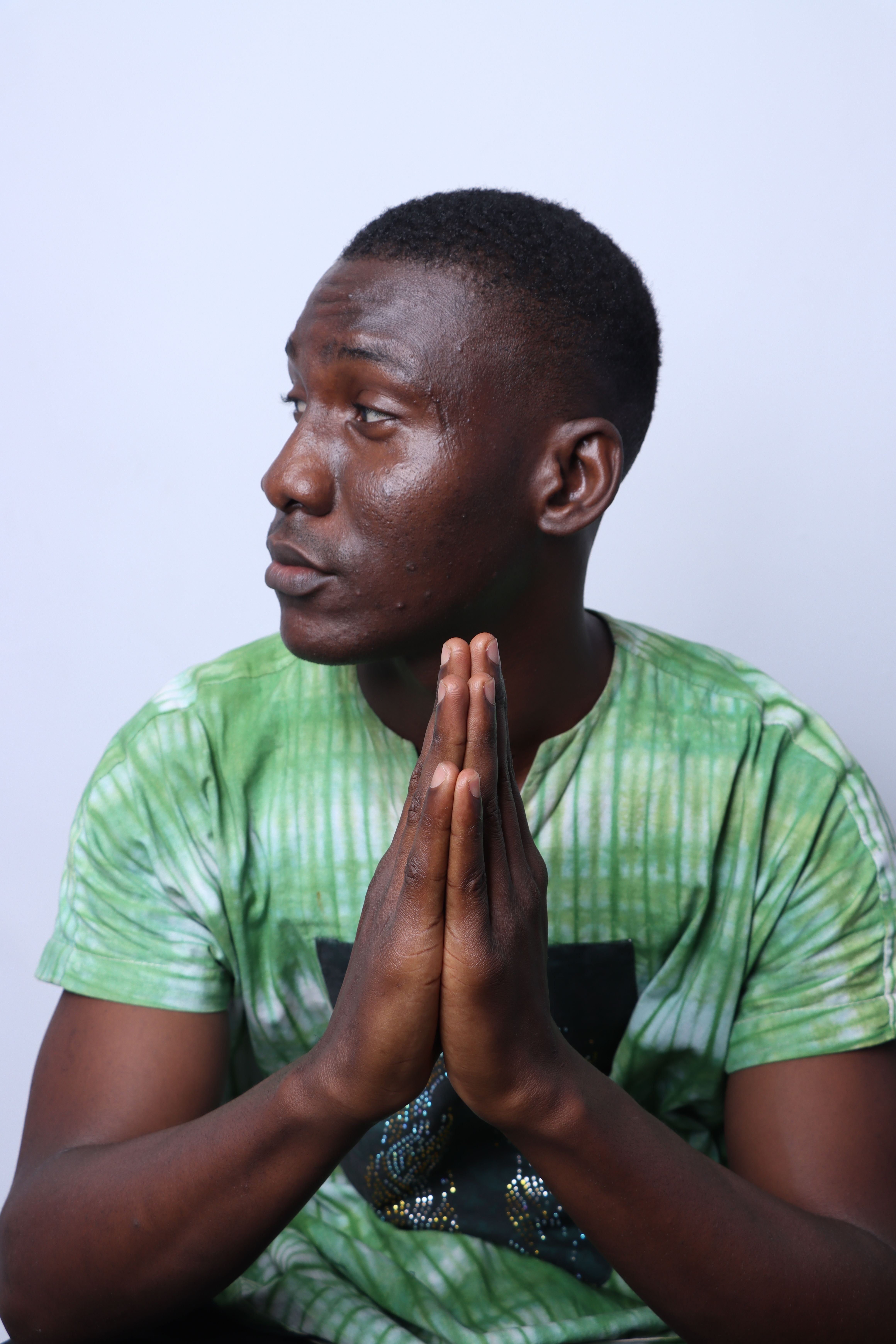 A Man Standing and Praying · Free Stock Photo