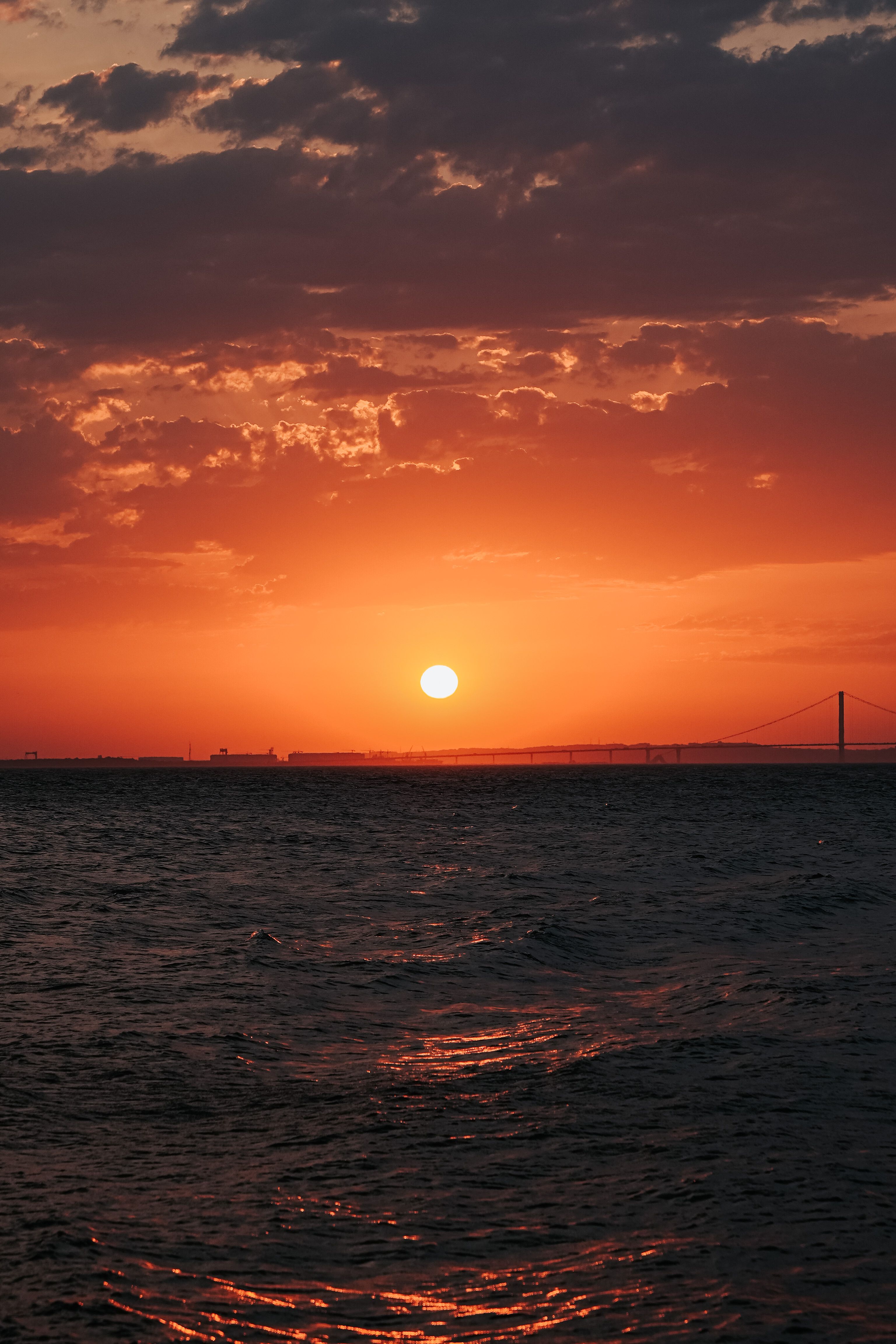 Sun Setting Over the Horizon · Free Stock Photo