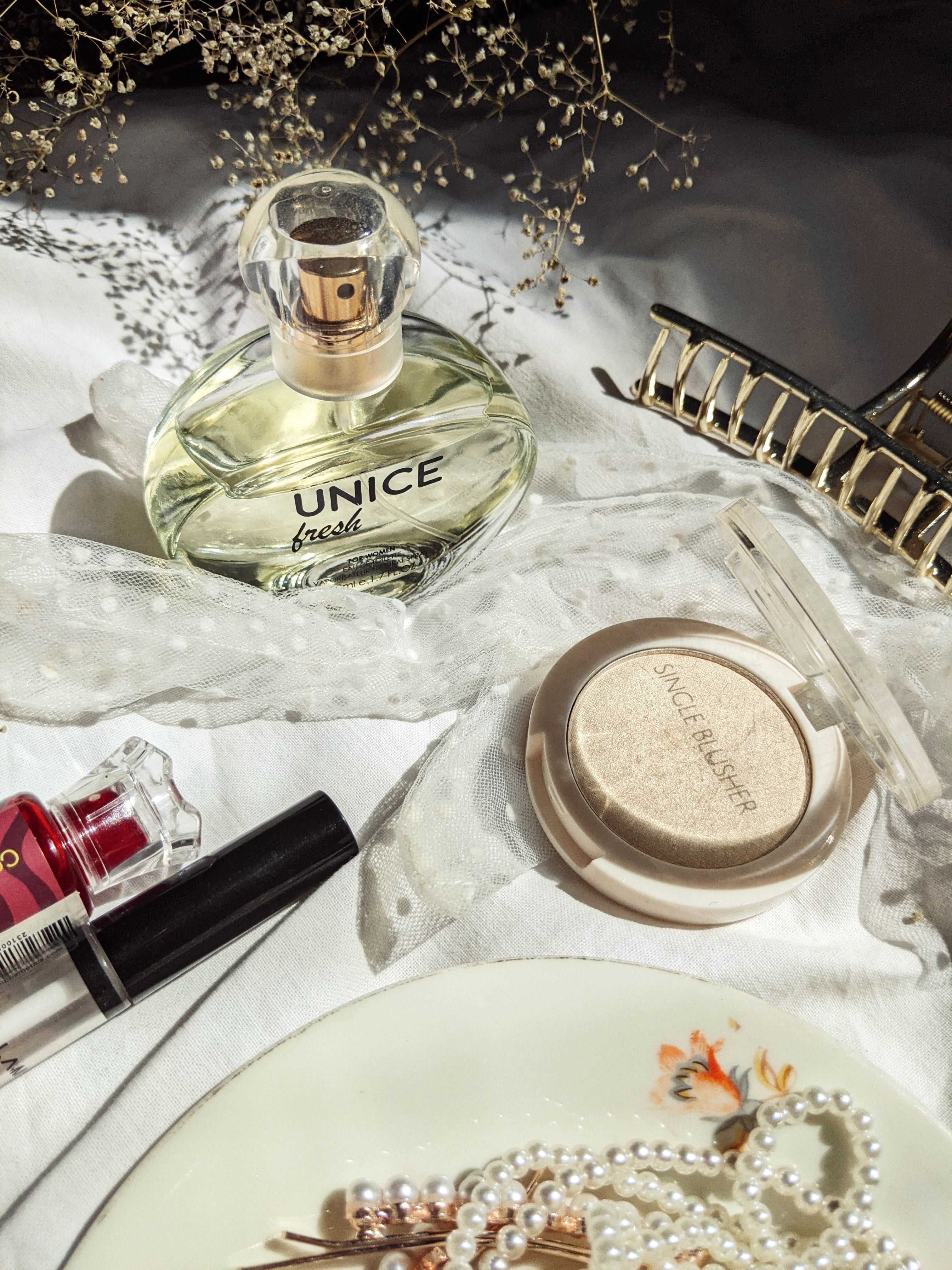 Perfume and Powder on White Background · Free Stock Photo