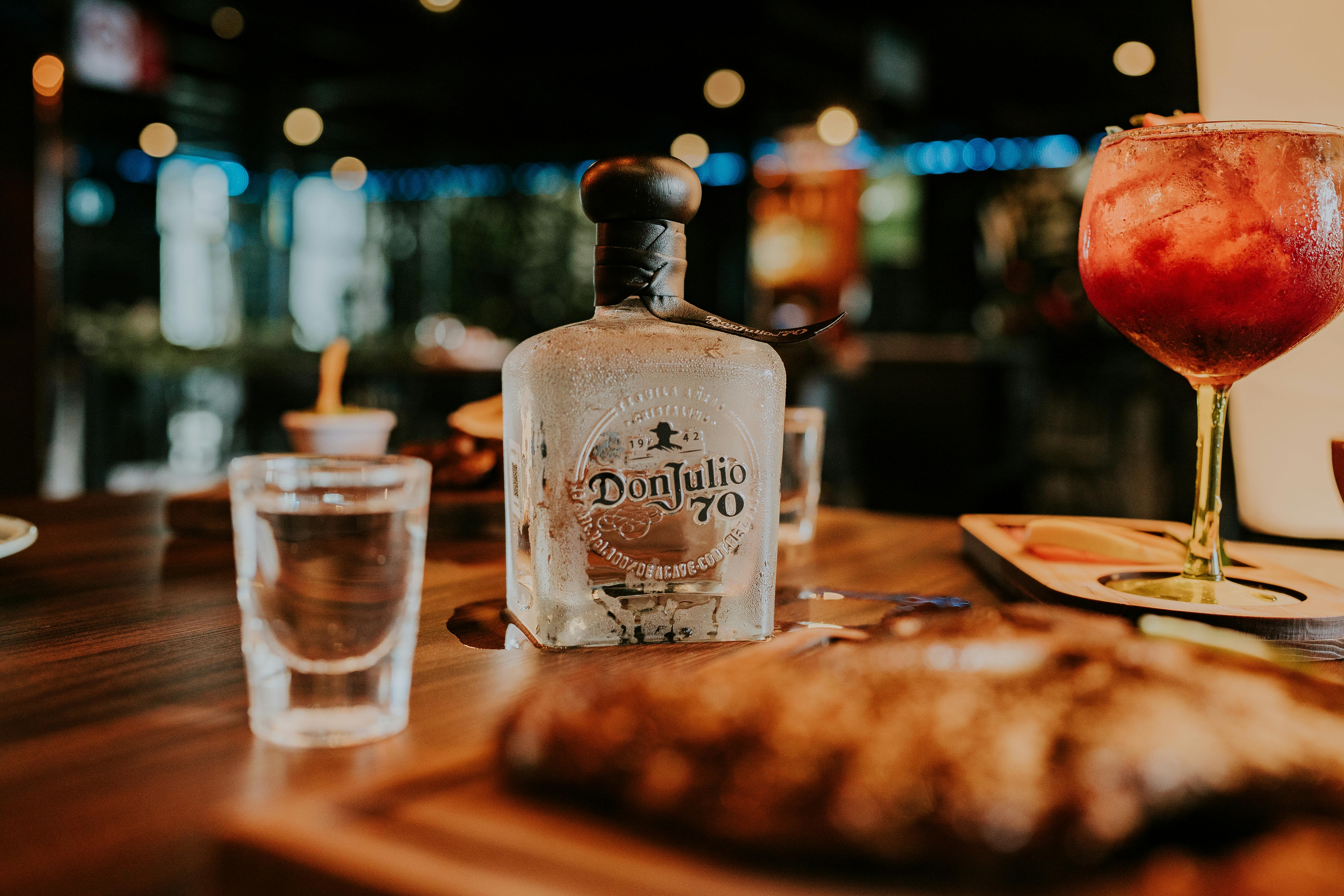Bottle Of Premium Tequila On A Wooden Table Photos, Download The BEST ...