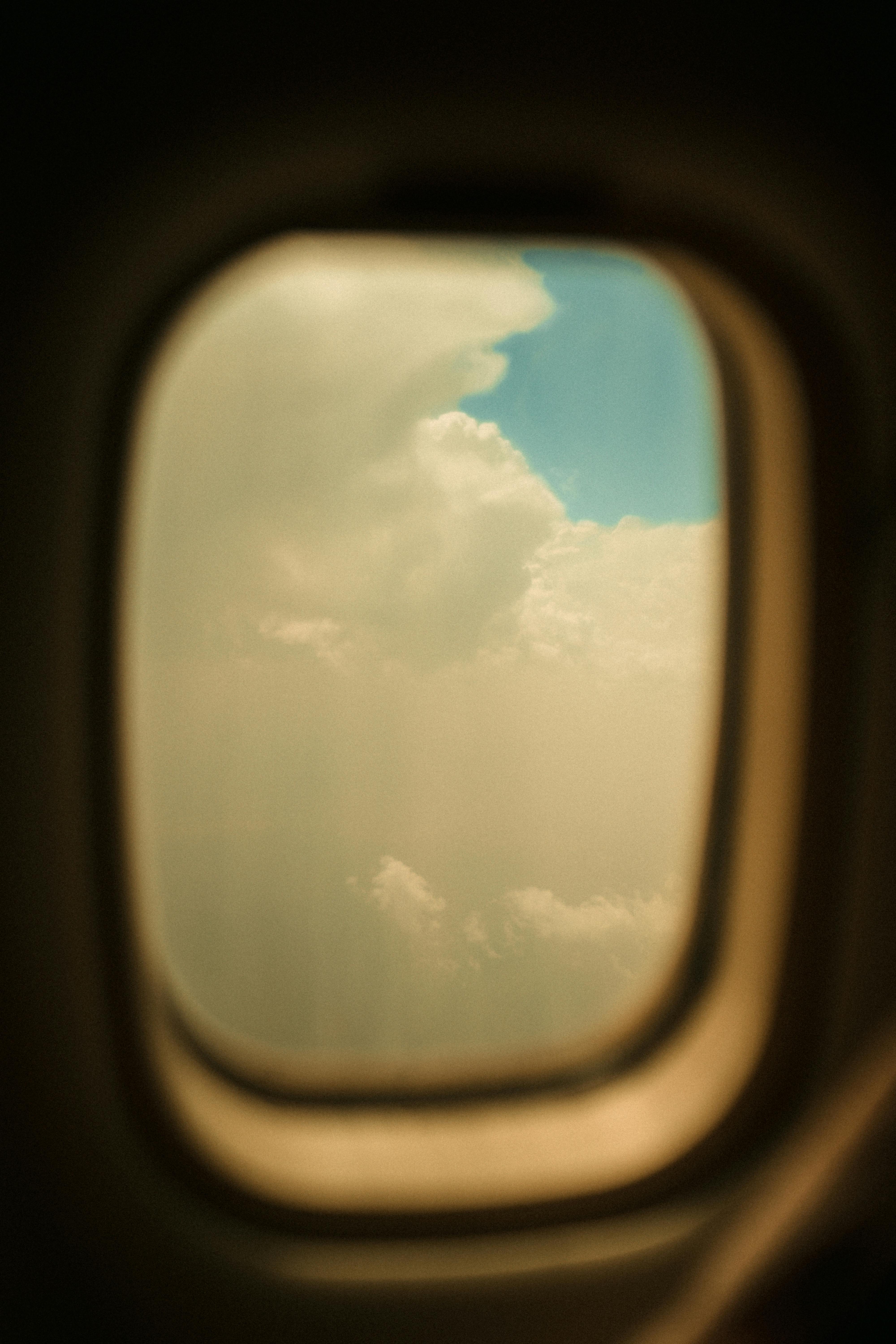 Hand By Airplane Window · Free Stock Photo