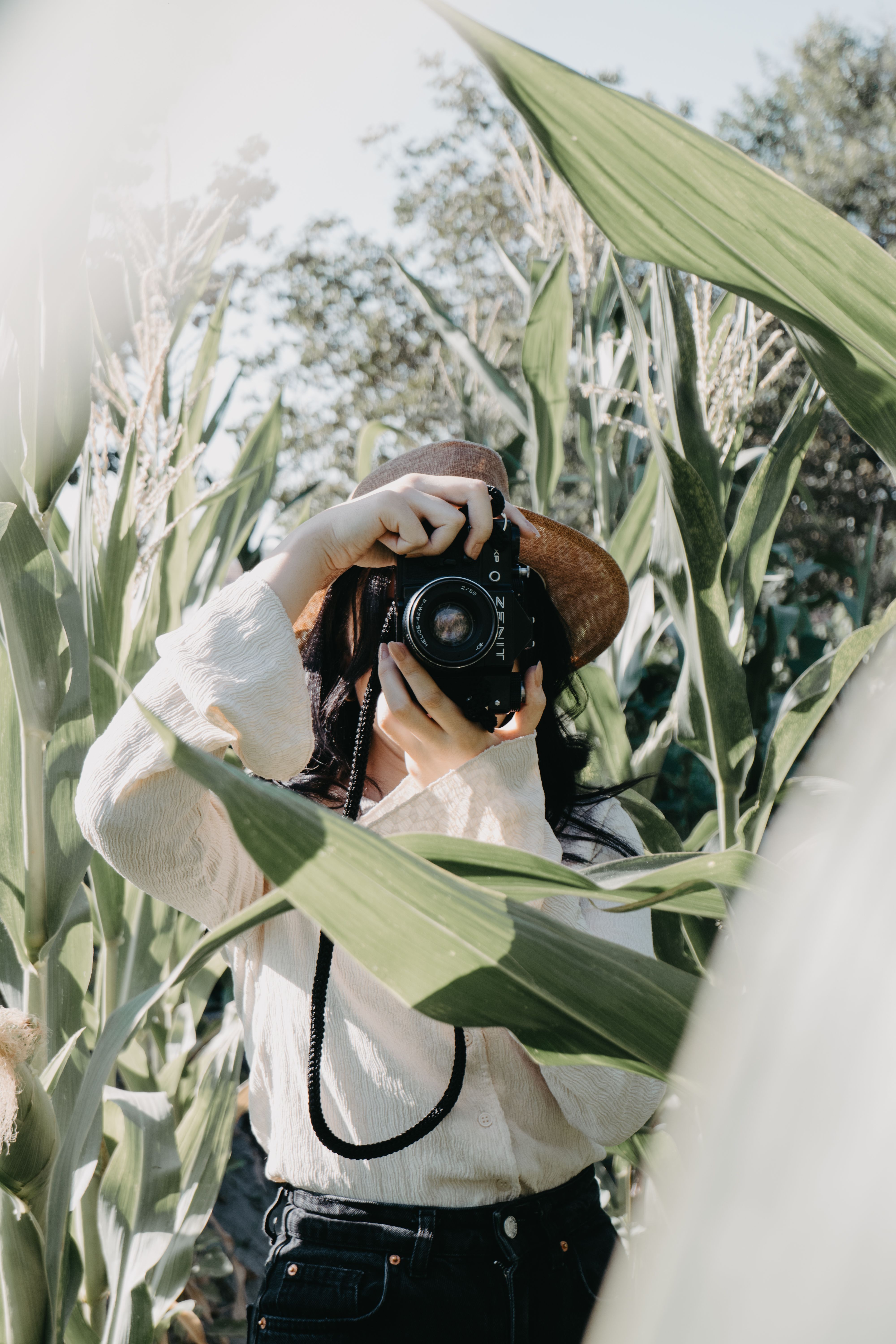 Woman Taking Photos with a Camera · Free Stock Photo