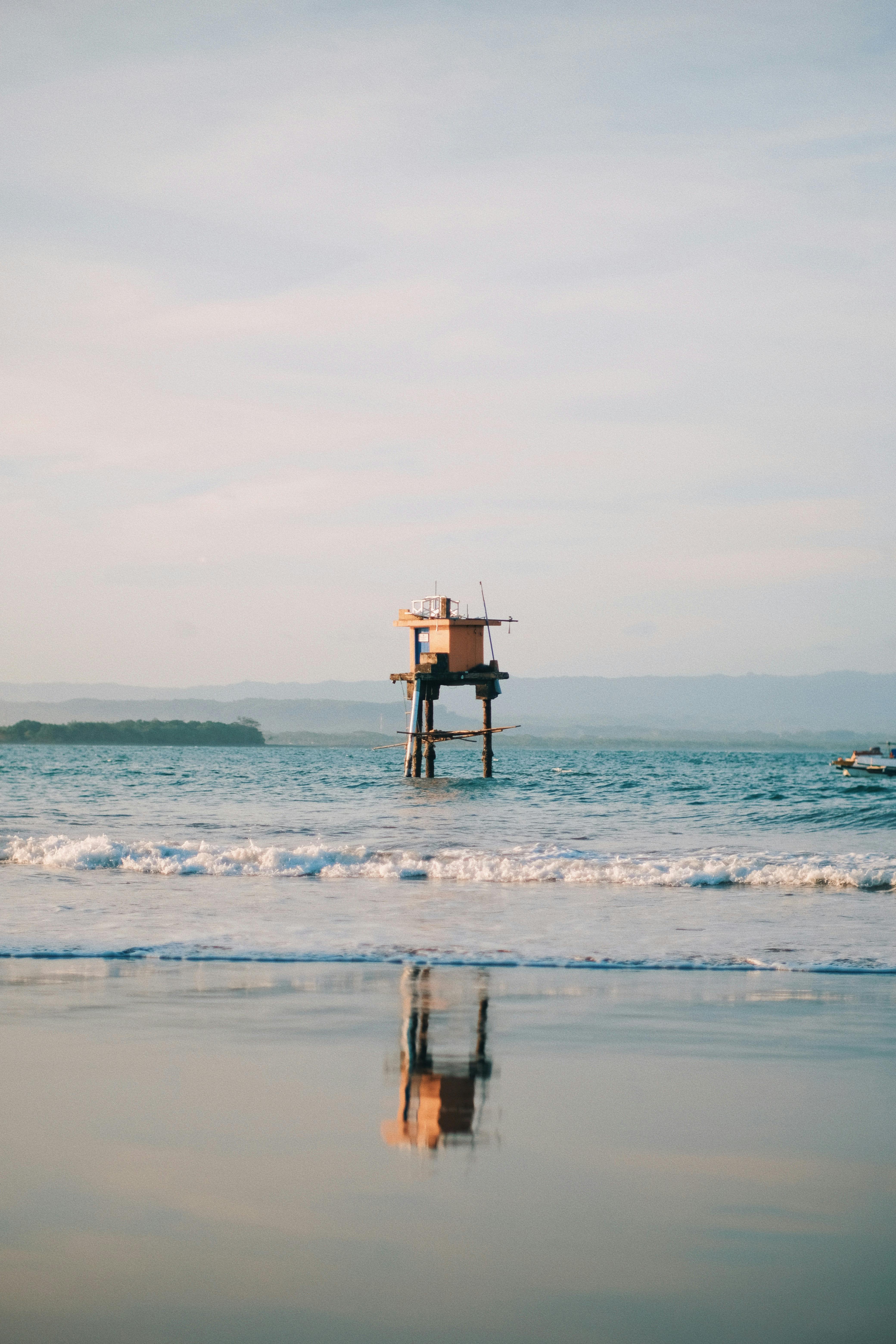 Fishing Tower in Sea near to Beach · Free Stock Photo