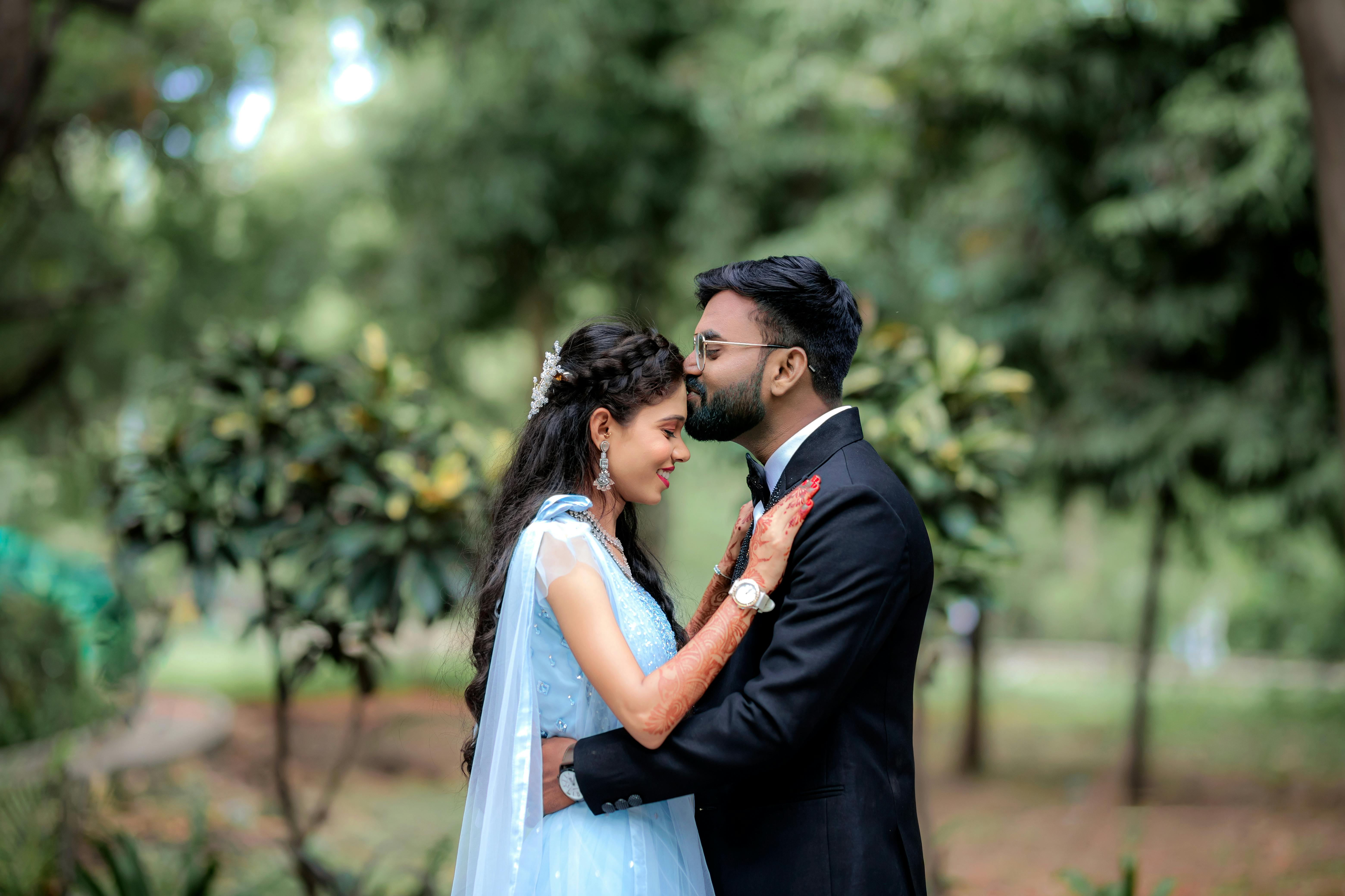 Young Bride and Groom Kissing · Free Stock Photo