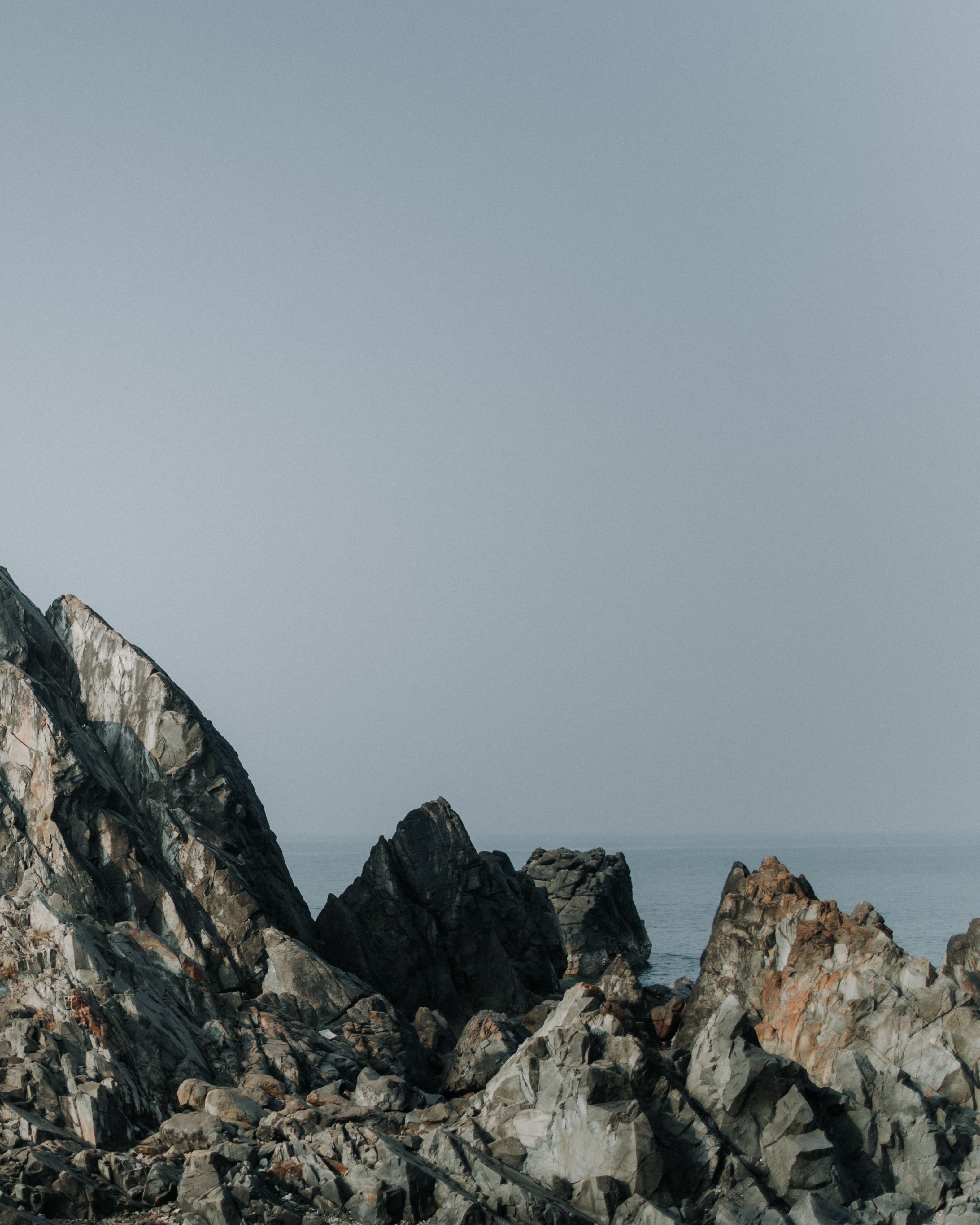Spiky Rock at Sea · Free Stock Photo