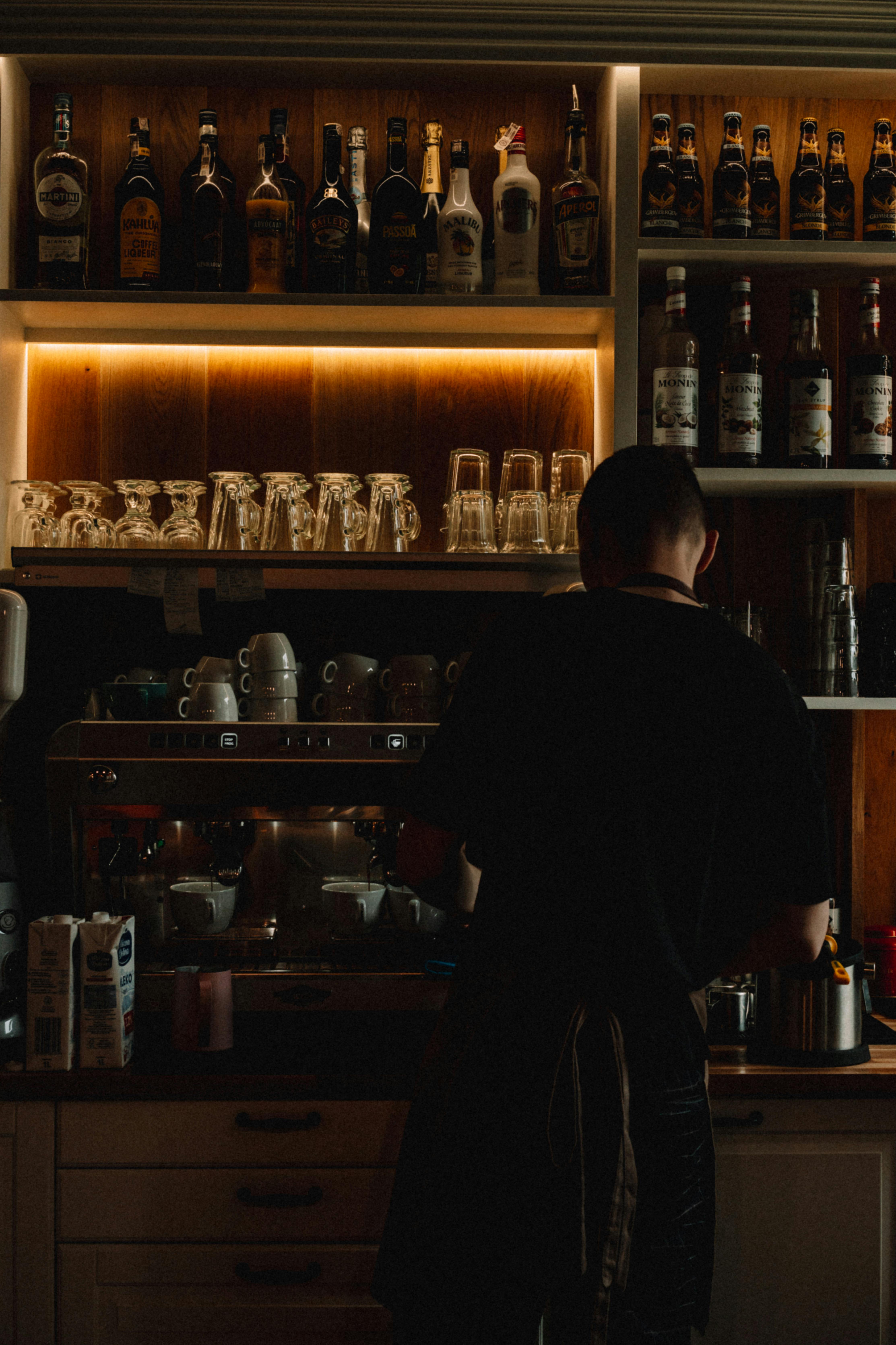 Bartender Serving a Couple at the Bar · Free Stock Photo