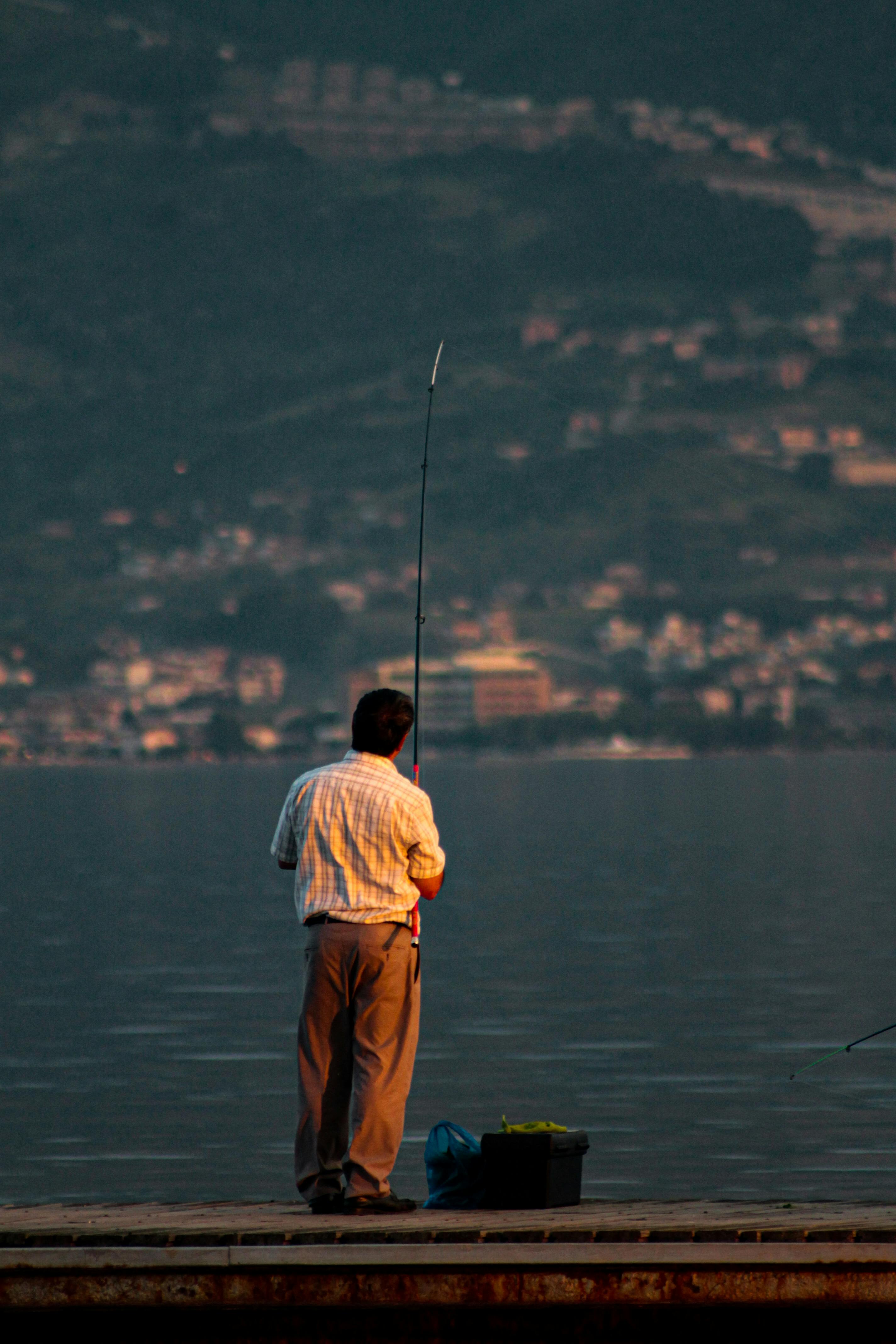 Back View of a Man Fishing · Free Stock Photo