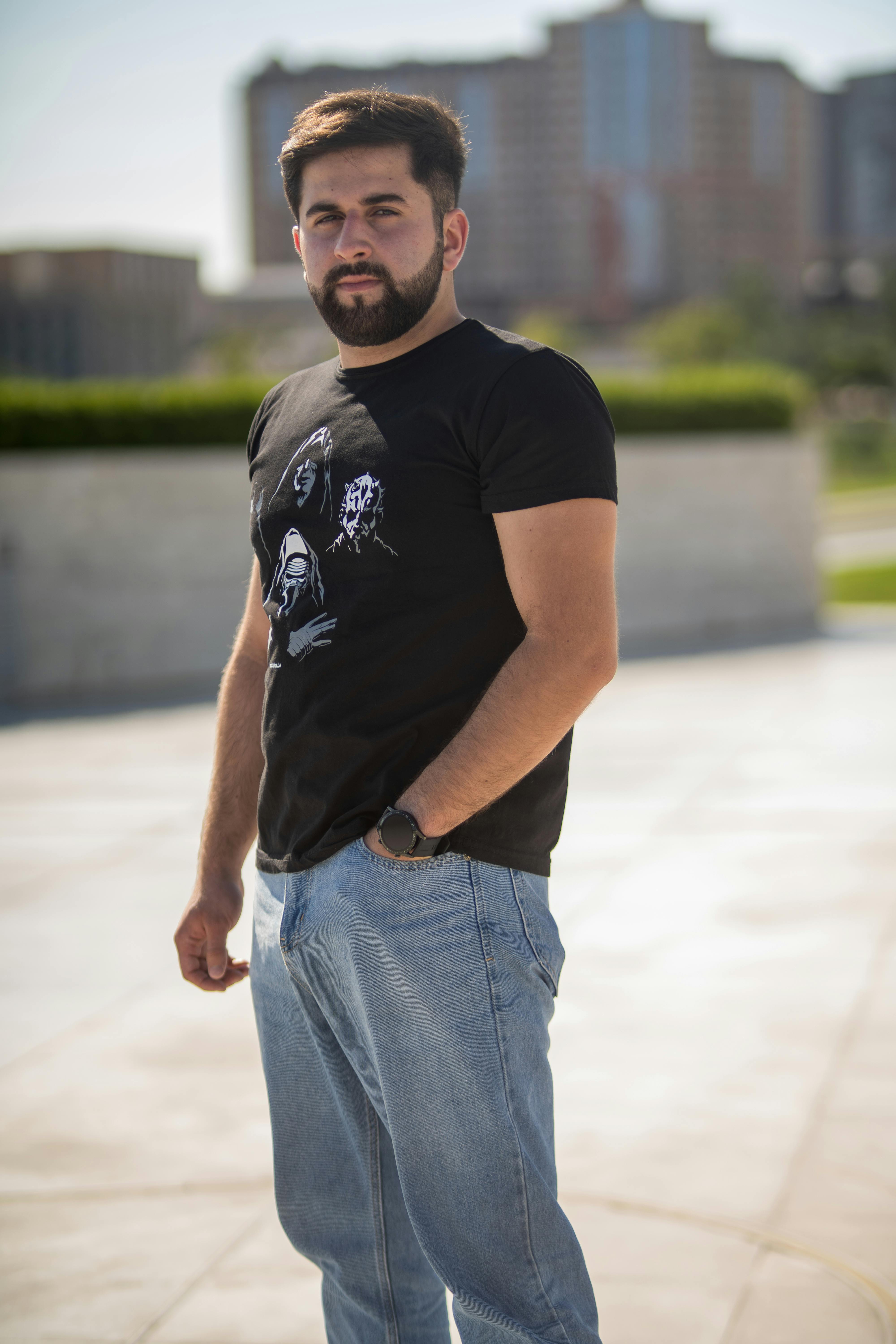 Young Man in Jeans and a Polo T-shirt Posing in Studio · Free Stock Photo
