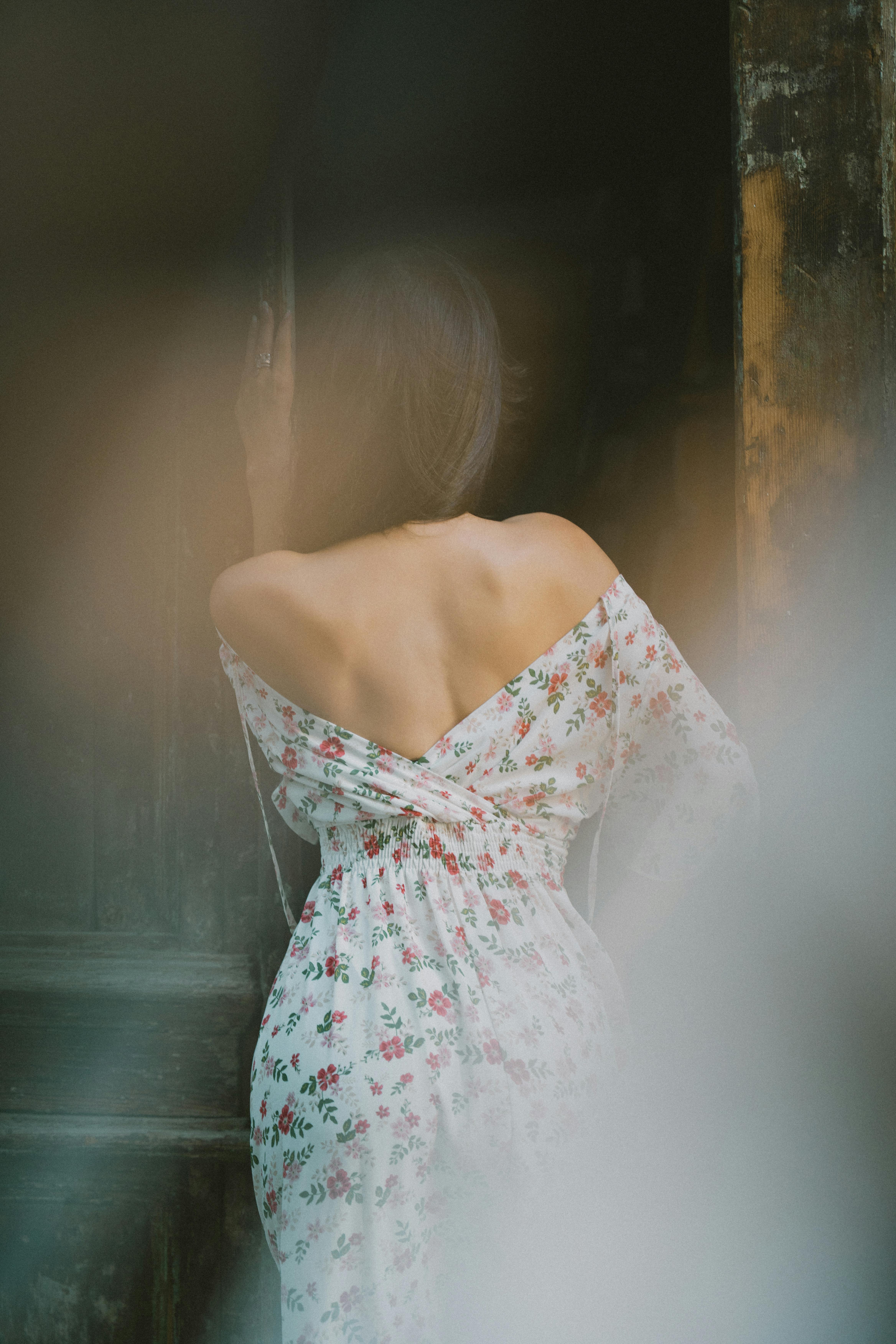 Back View of Woman in Sundress Standing by Door · Free Stock Photo