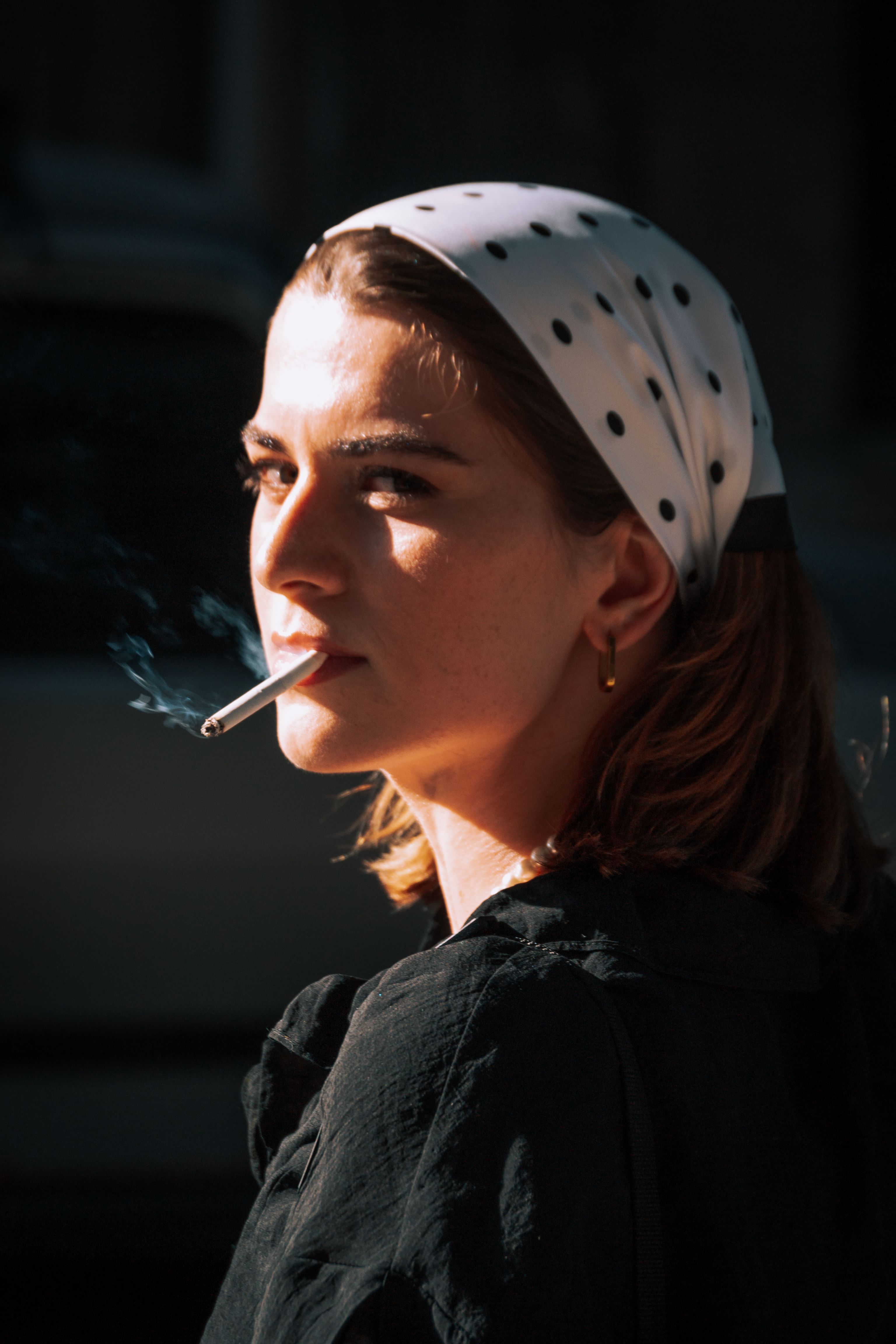 Portrait of Woman Wearing Headscarf Smoking Cigarette · Free Stock Photo