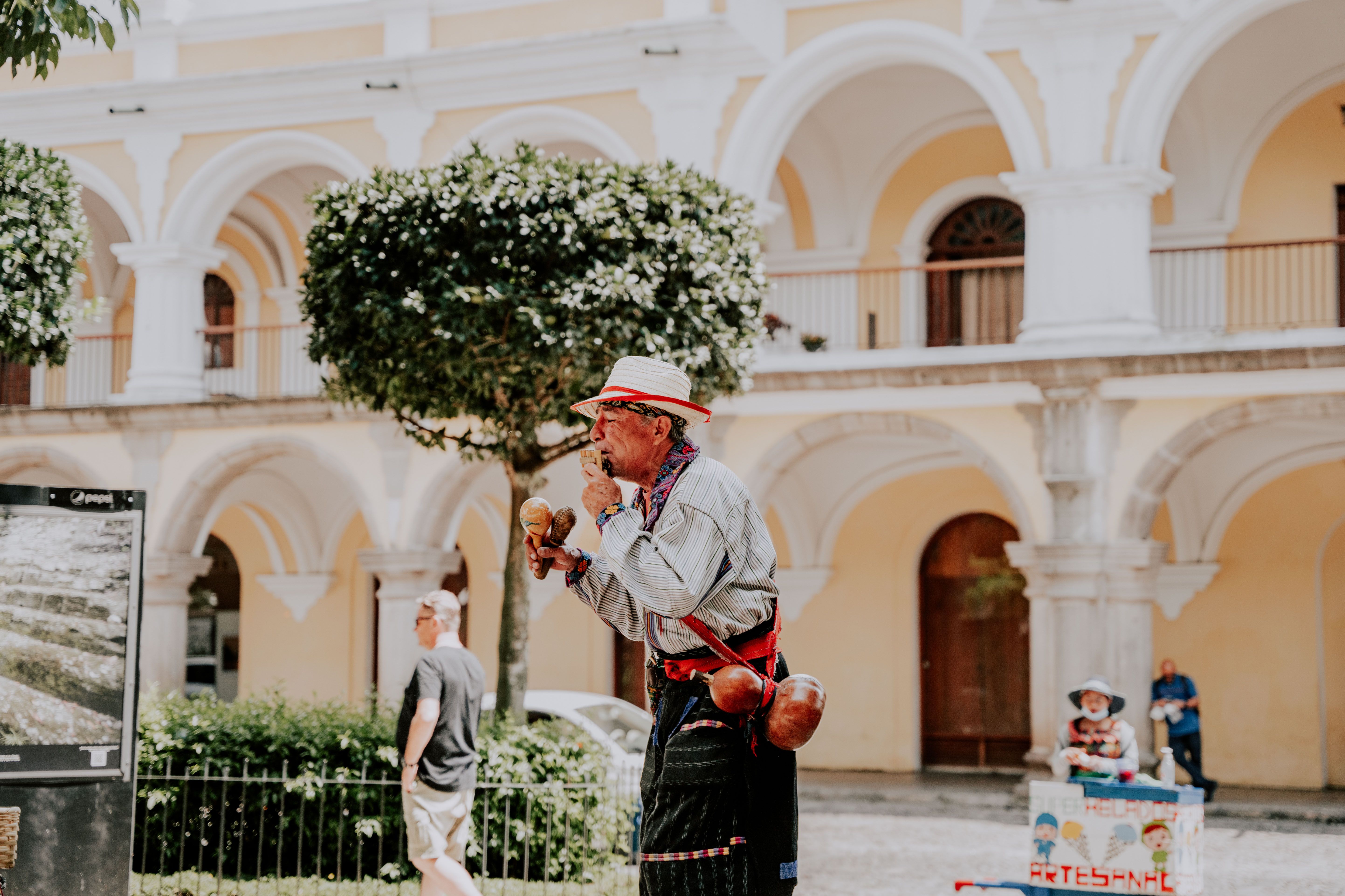 Man Playing Maraca on Towns Square · Free Stock Photo