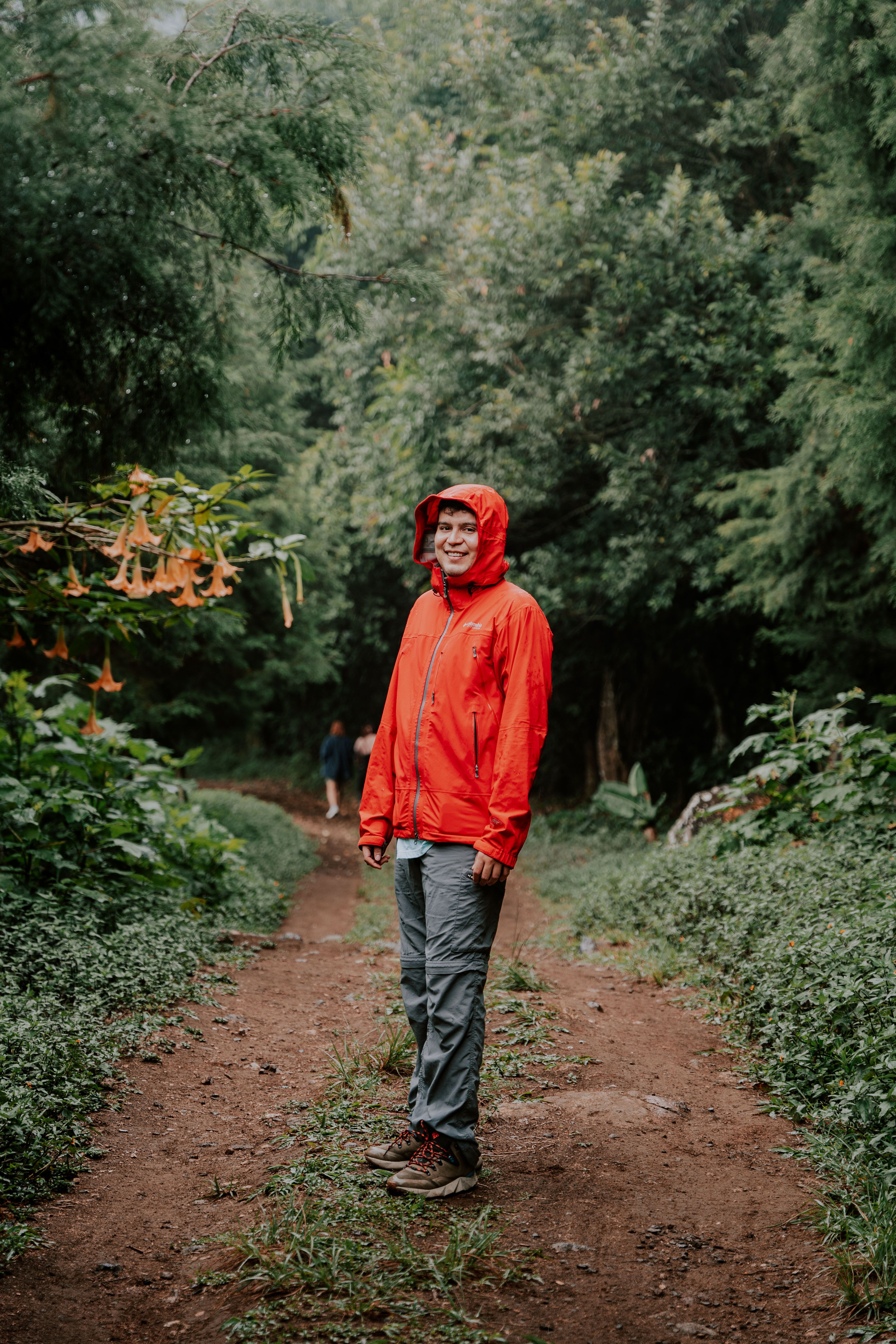 Smiling Man in Red Jacket in Forest · Free Stock Photo