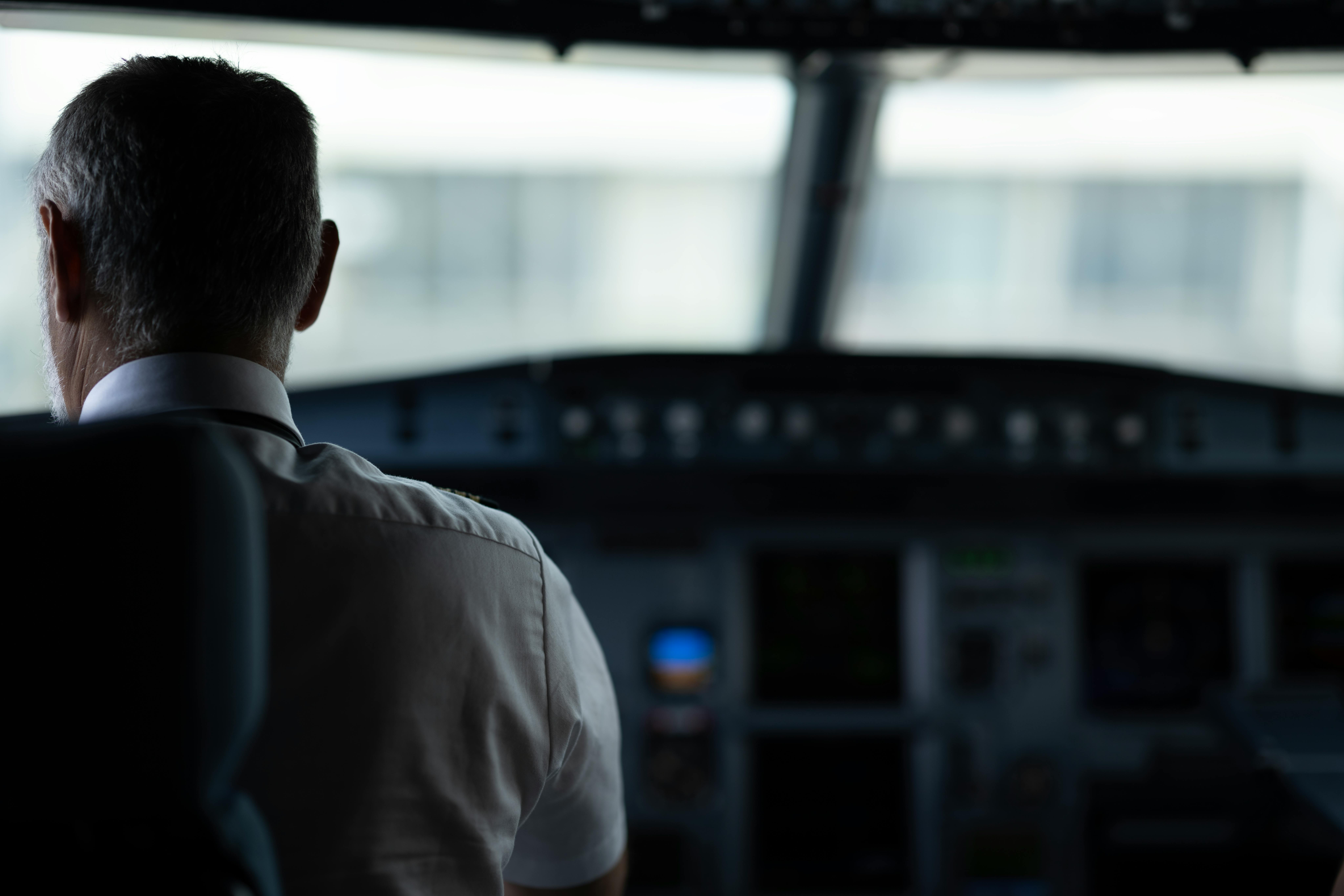 Pilot in Airplane · Free Stock Photo
