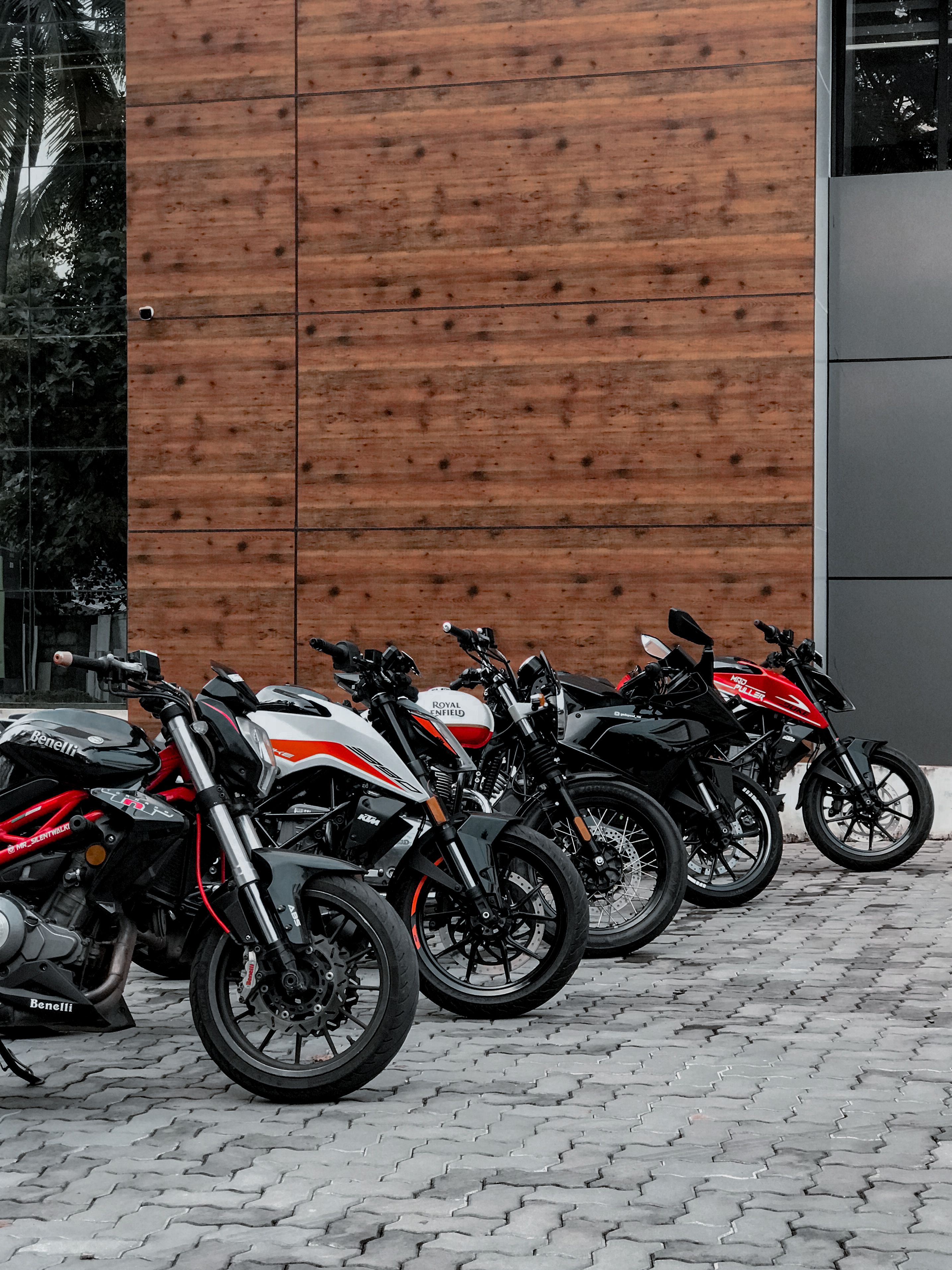 Black Motorcycles Parked Beside Brick Wall on the Narrow Street · Free ...
