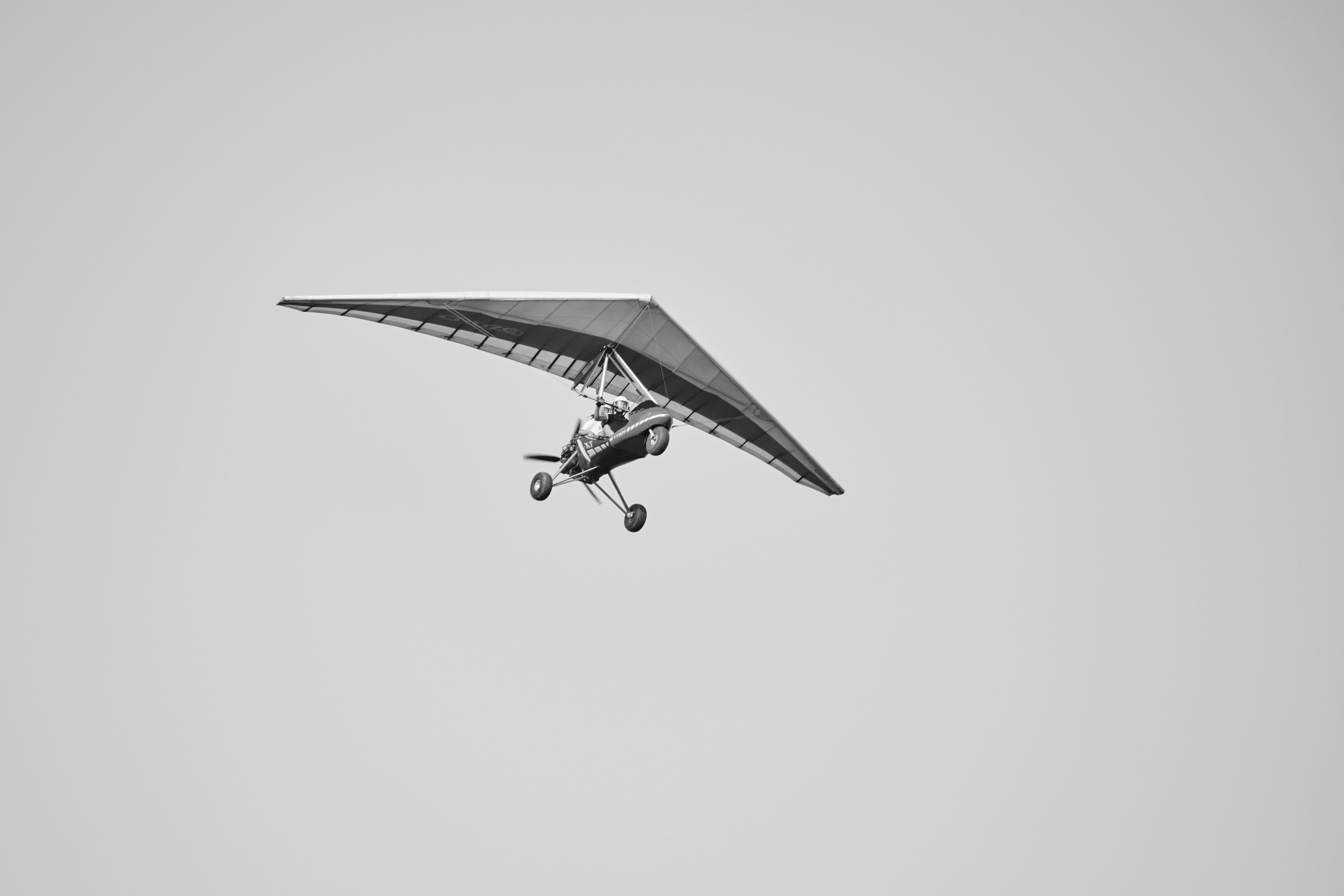 Motorized Glider Flying in Clear Sky · Free Stock Photo