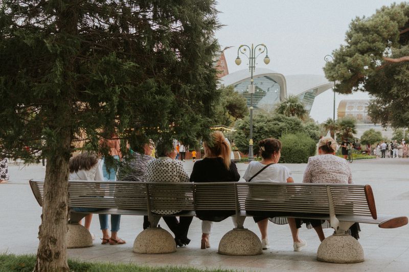 Group Of People Sitting On Bench Photos, Download The BEST Free Group ...