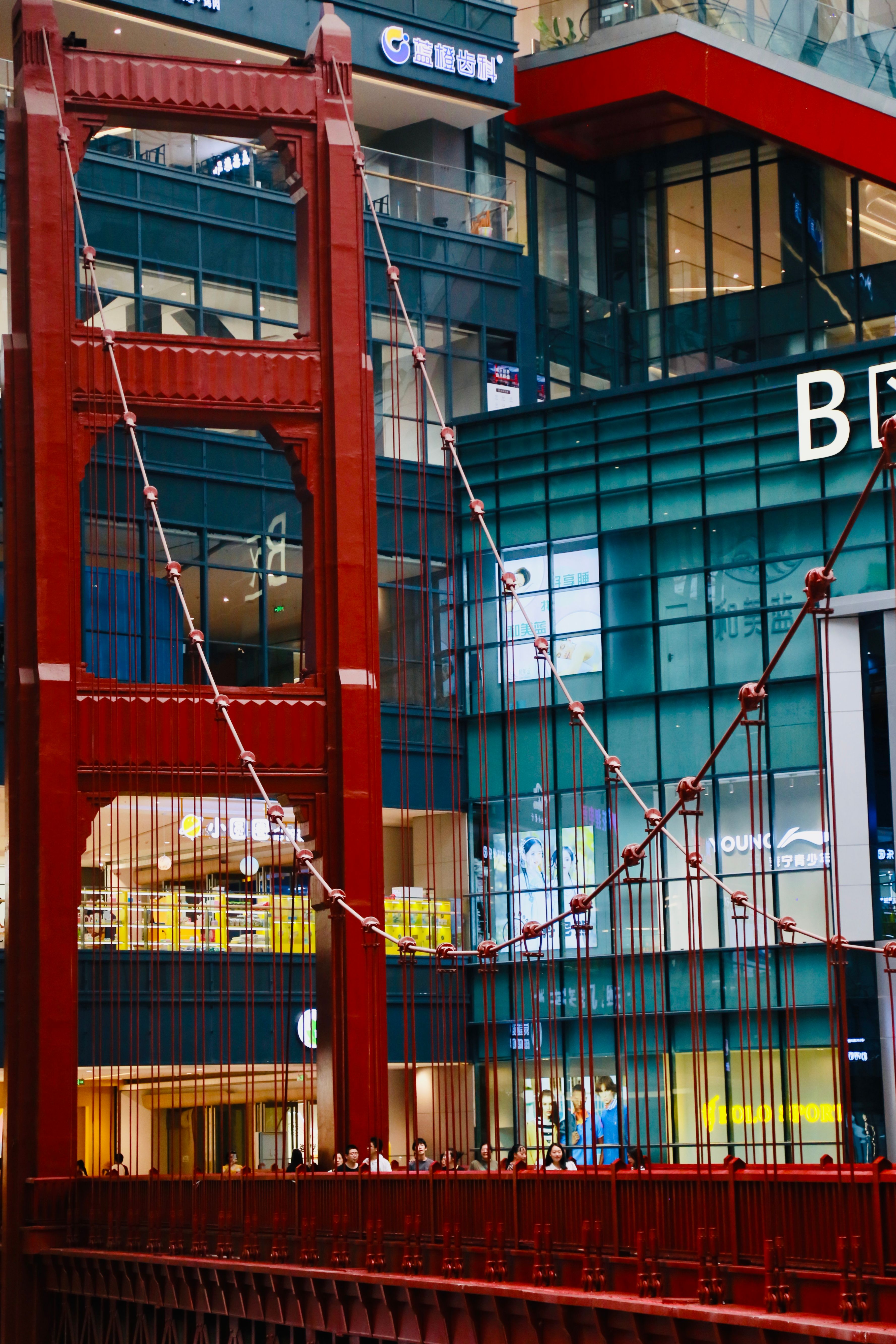 Red Pedestrian Footbridge in a Shopping Mall · Free Stock Photo