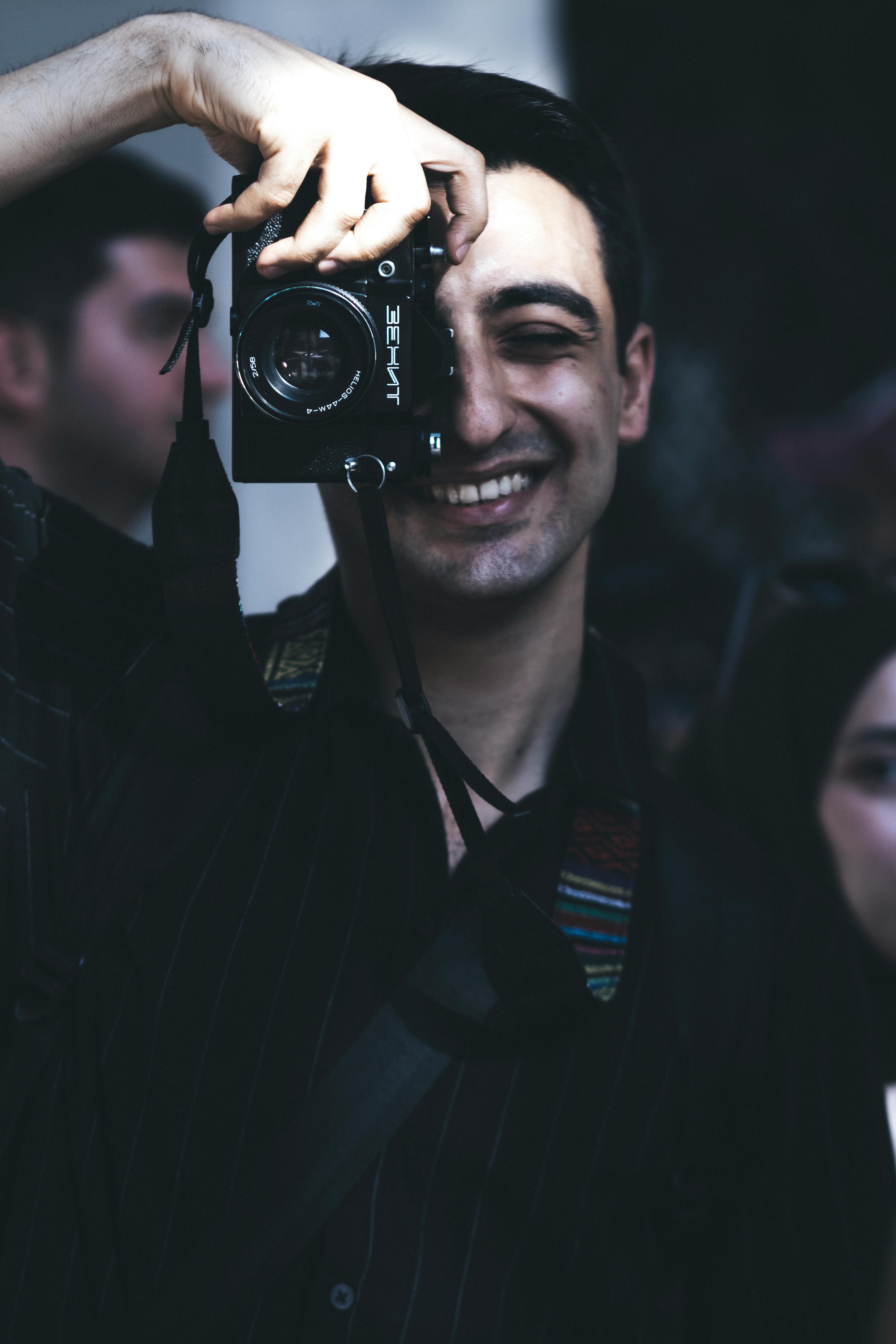 Person Holding Camera · Free Stock Photo