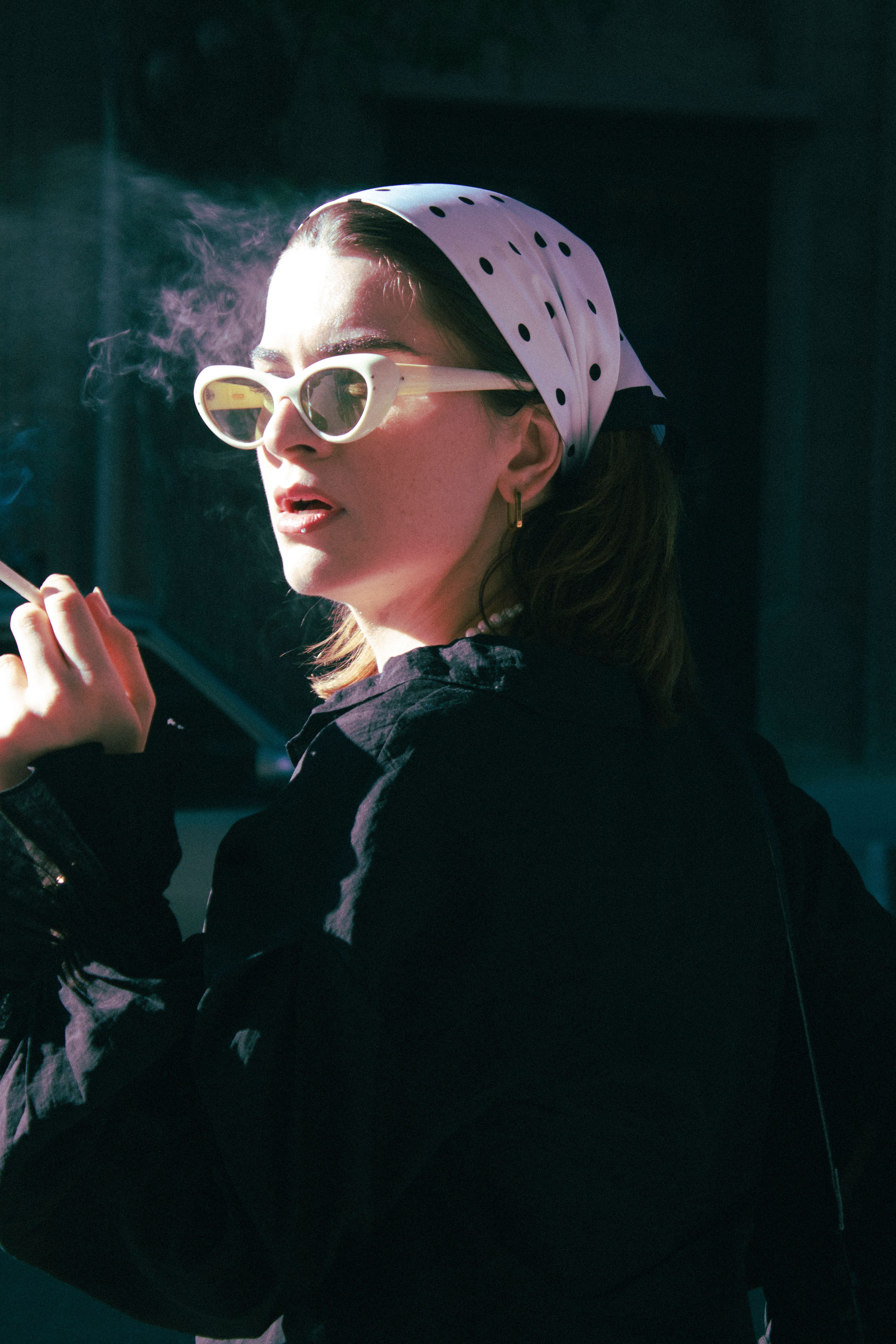 Woman Wearing Sunglasses and Headscarf Smoking Cigarette · Free Stock Photo