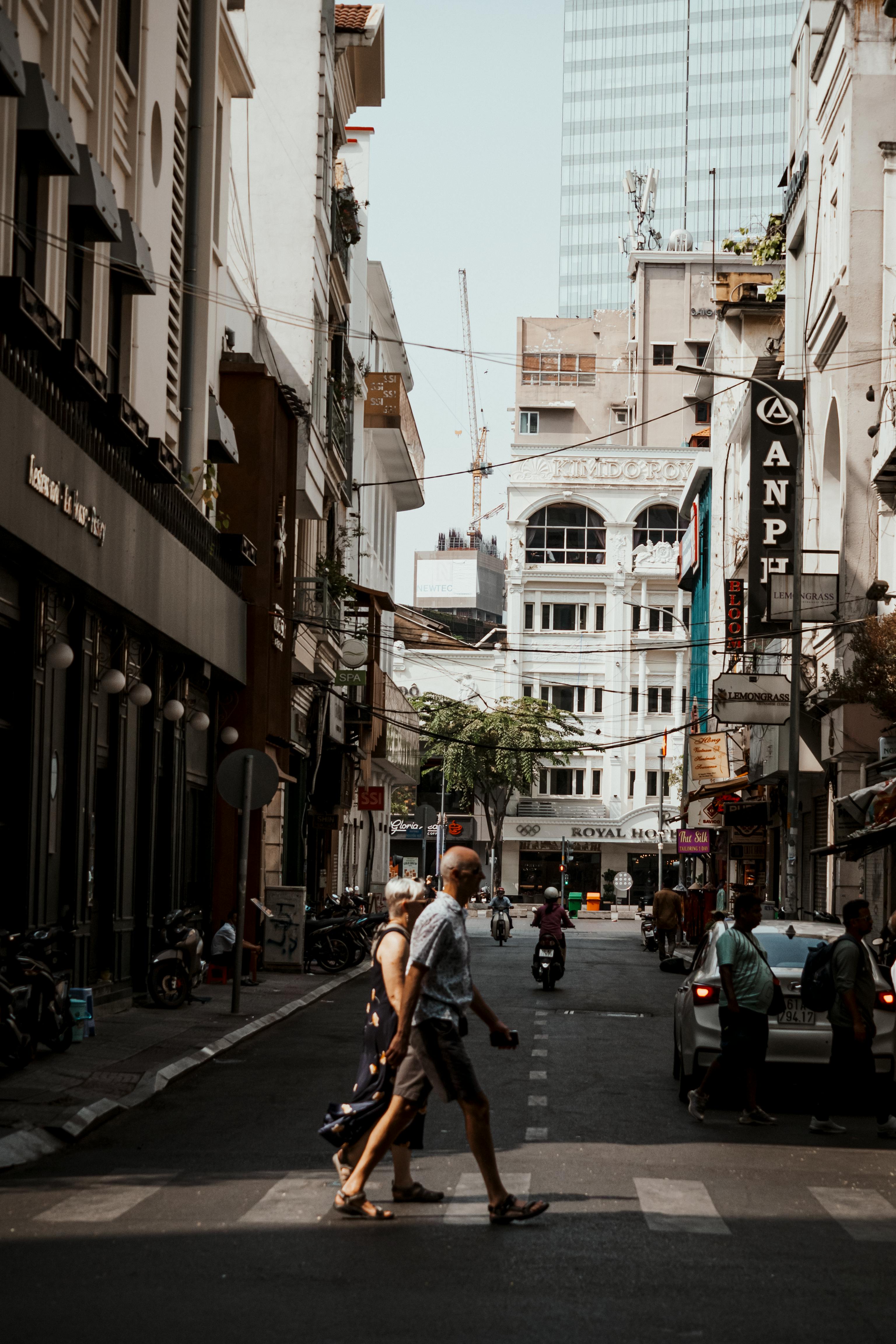 Tricycle Rider on Bustling City Street · Free Stock Photo