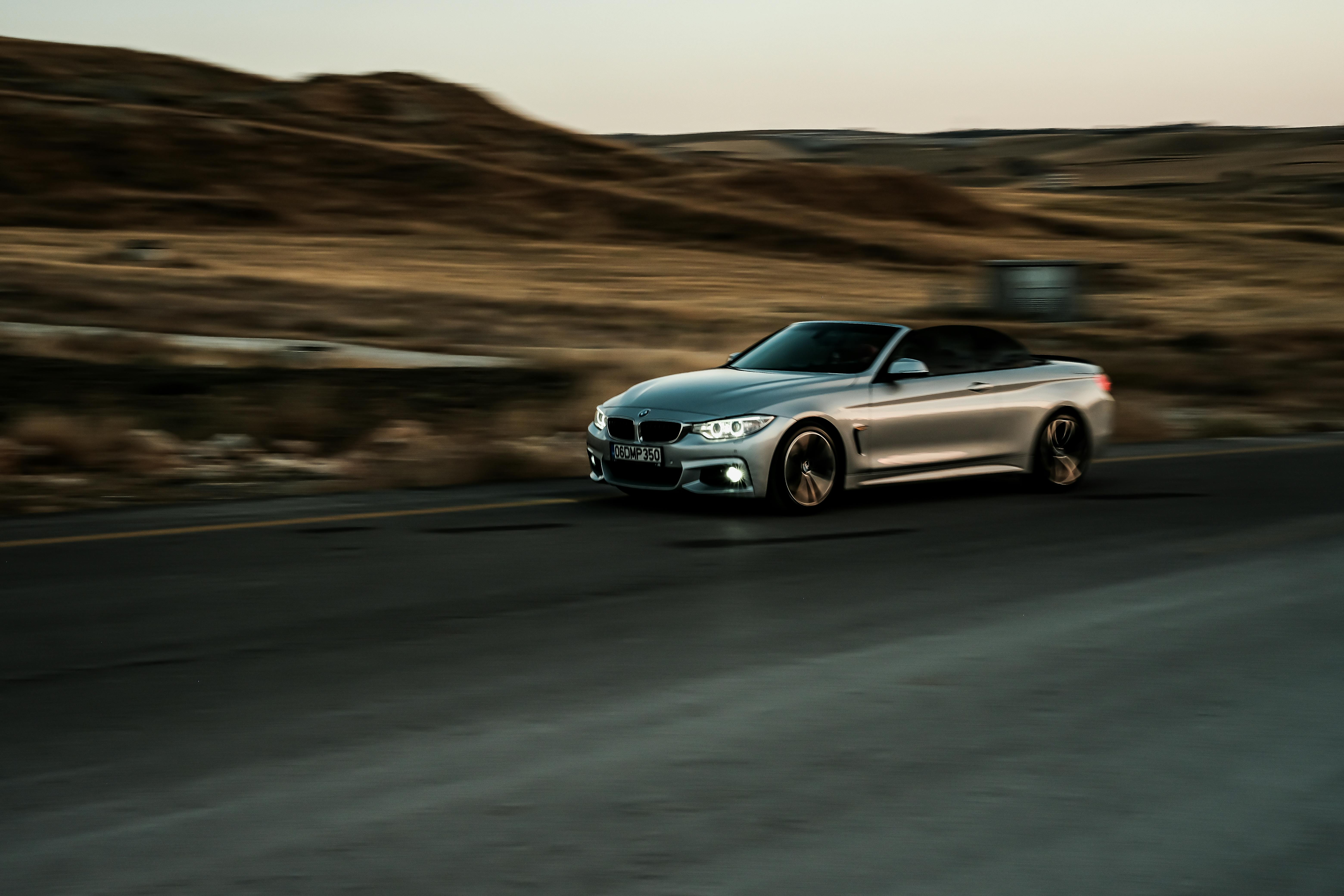 Convertible Silver Car is Driving Fast · Free Stock Photo