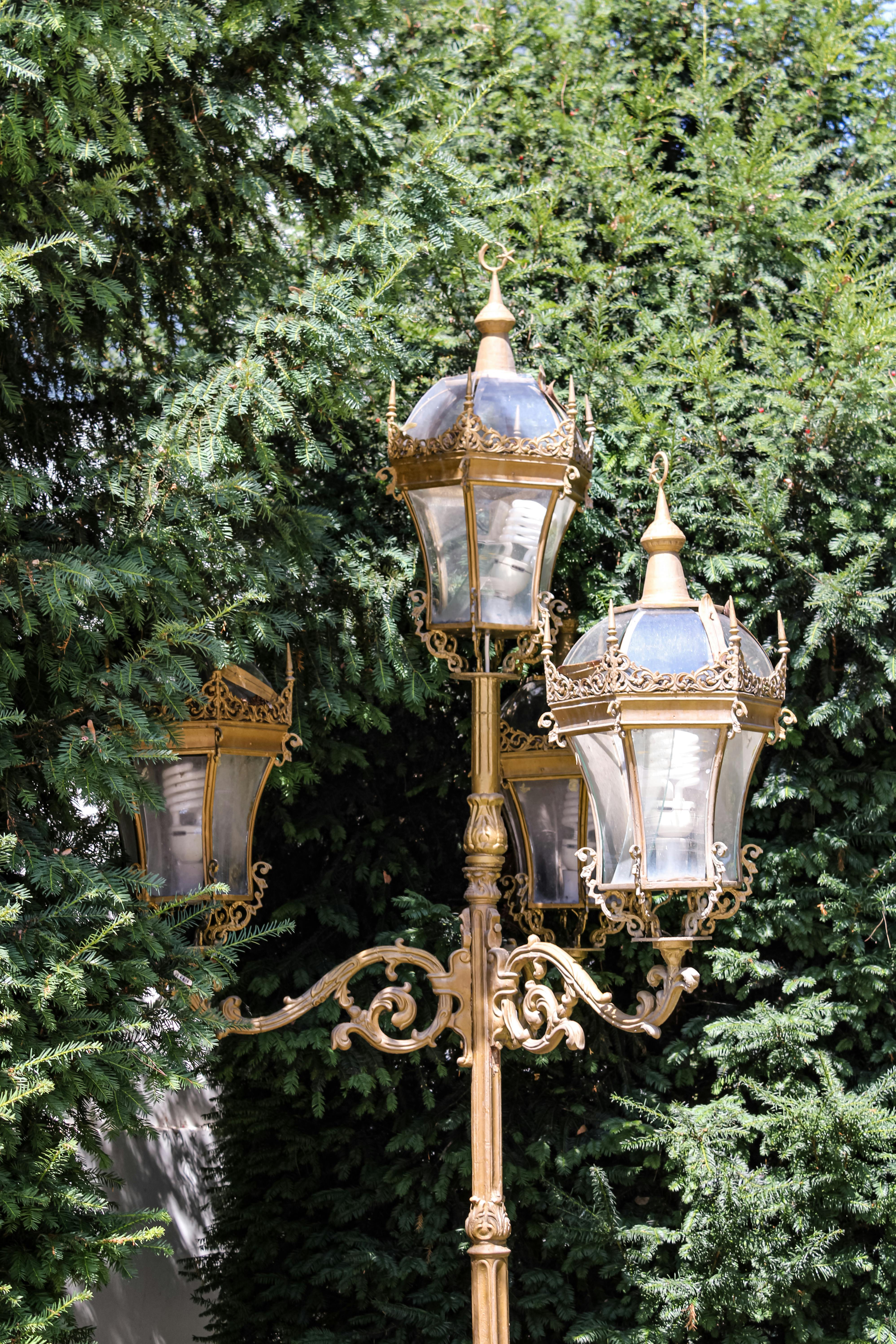Old-Fashioned Street Light Glowing over a Street · Free Stock Photo