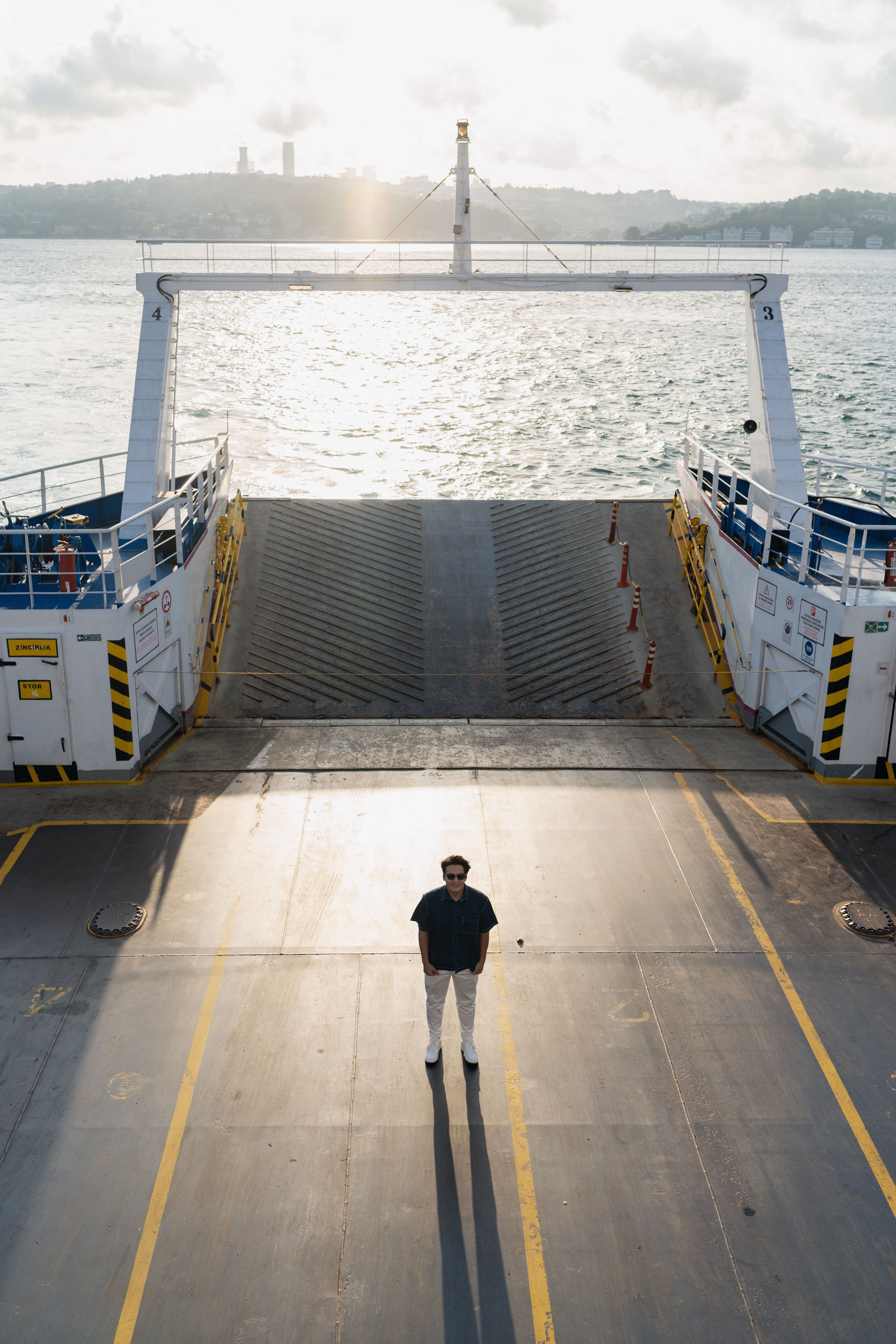 Man Standing on an Industrial Ship · Free Stock Photo