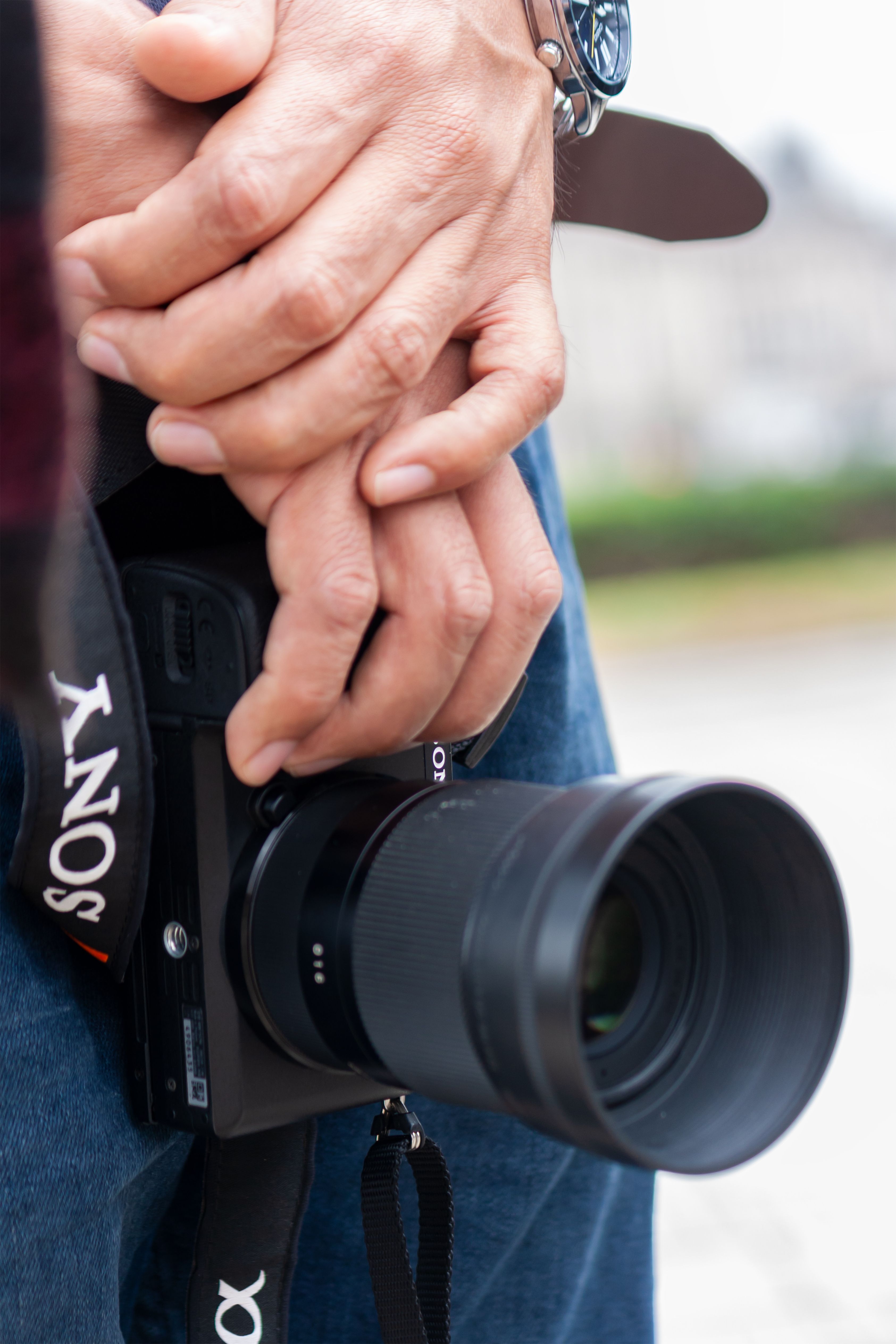 Close-up of Photographer Holding Camera in his Hands · Free Stock Photo