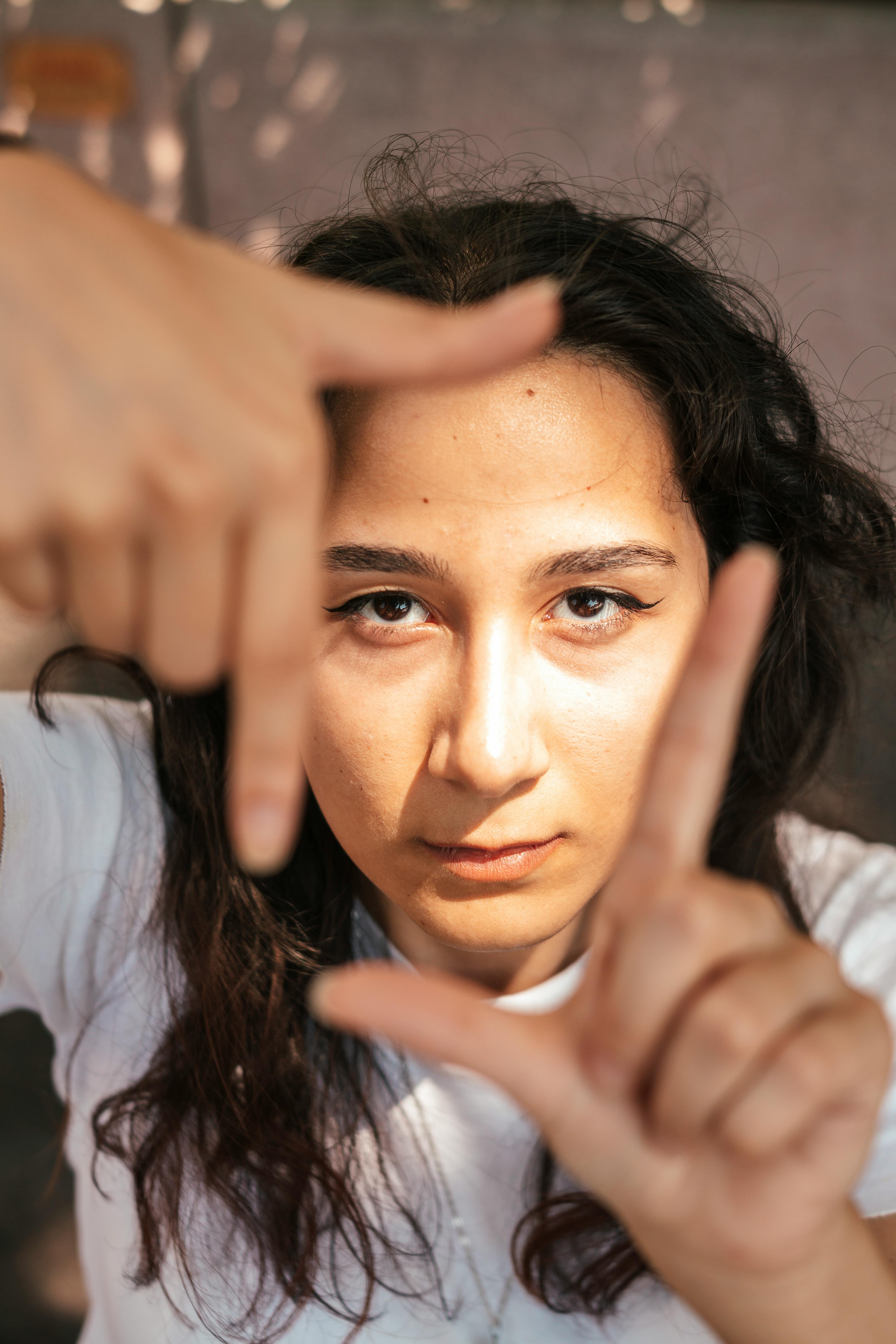 Woman Making Frame with her Hands · Free Stock Photo