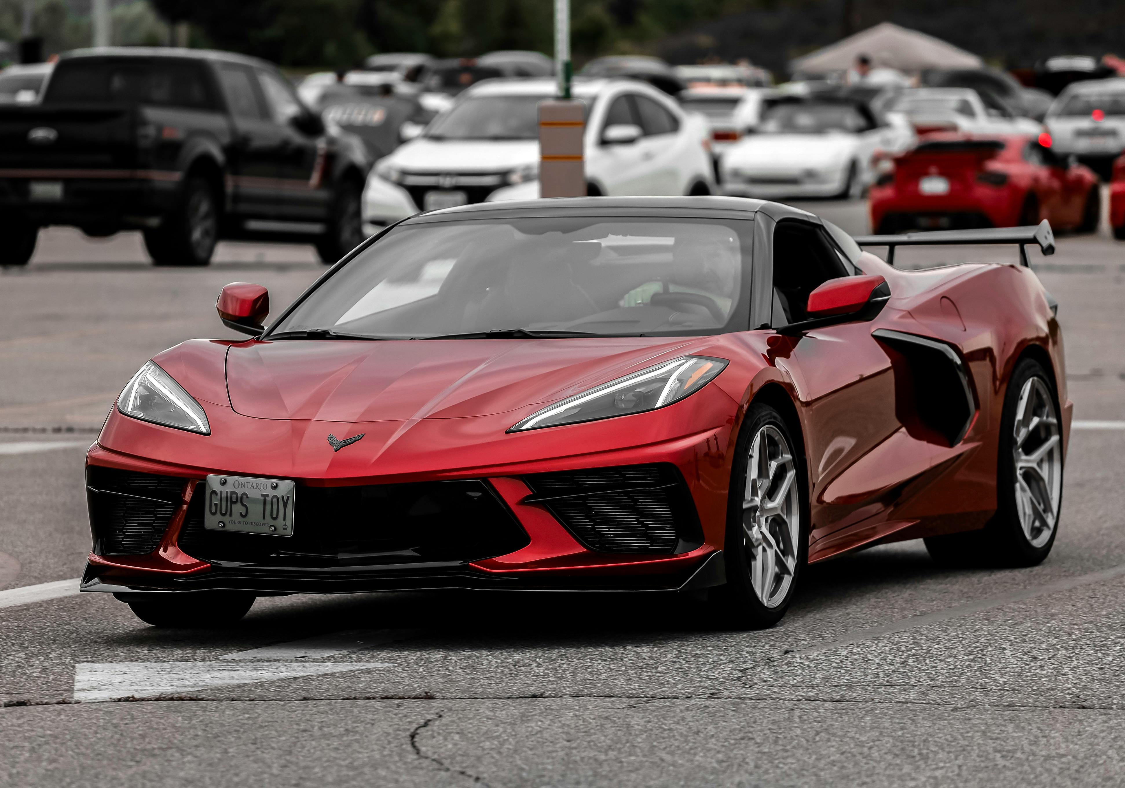 Red Chevrolet Corvette C8 on a Parking Lot · Free Stock Photo