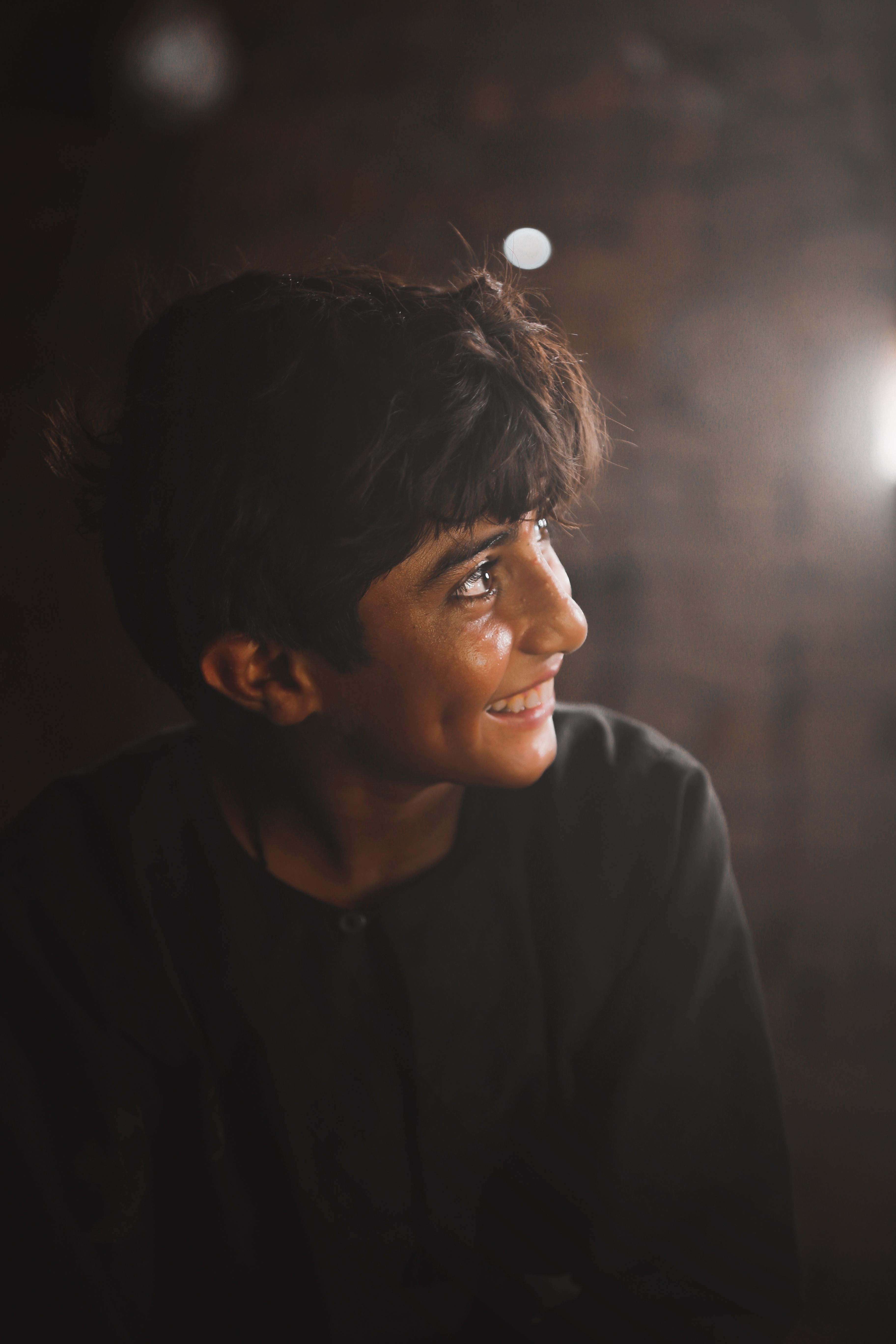 Smiling Boy with Black Hair · Free Stock Photo