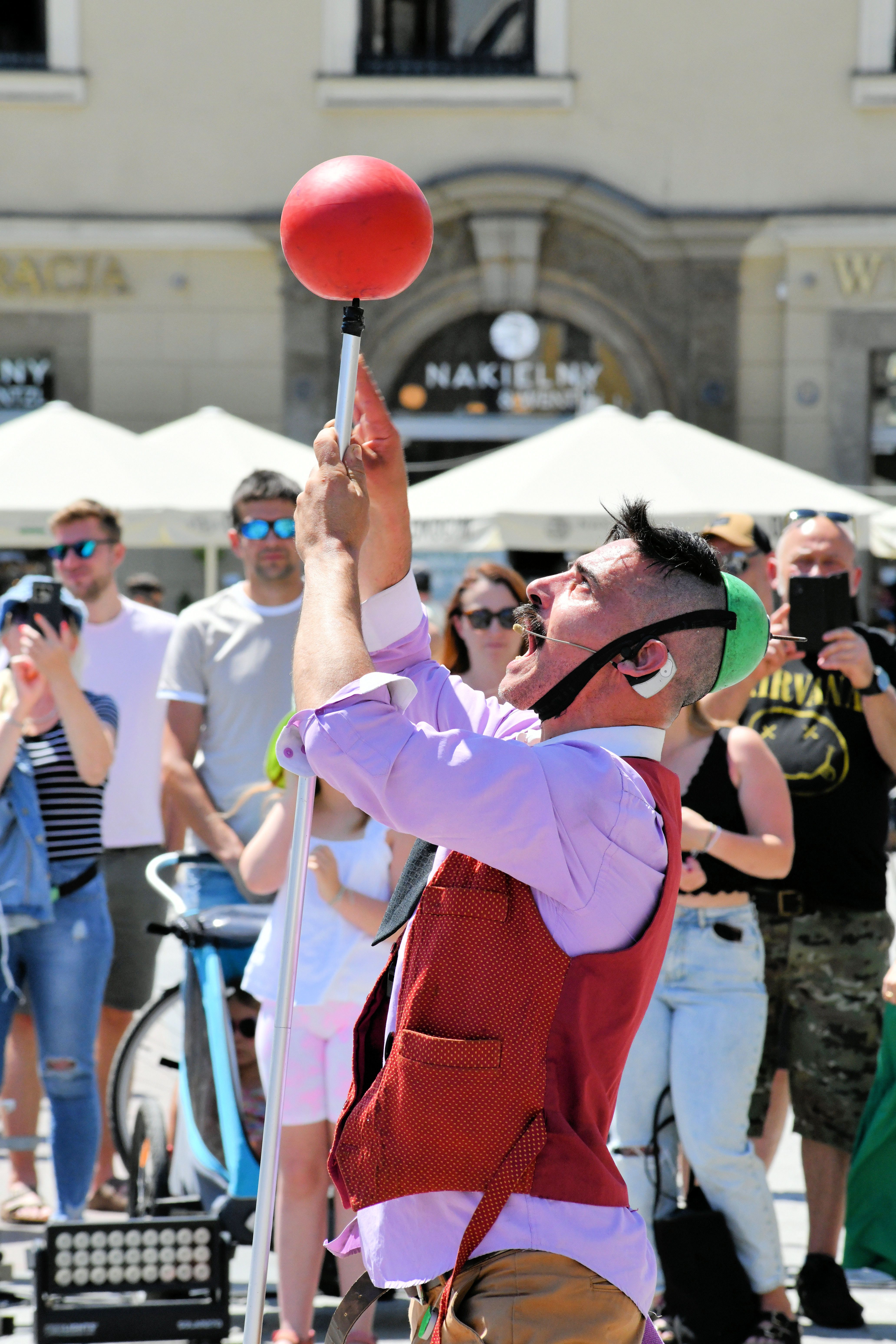 Clown Performing on Street with Red Ball · Free Stock Photo