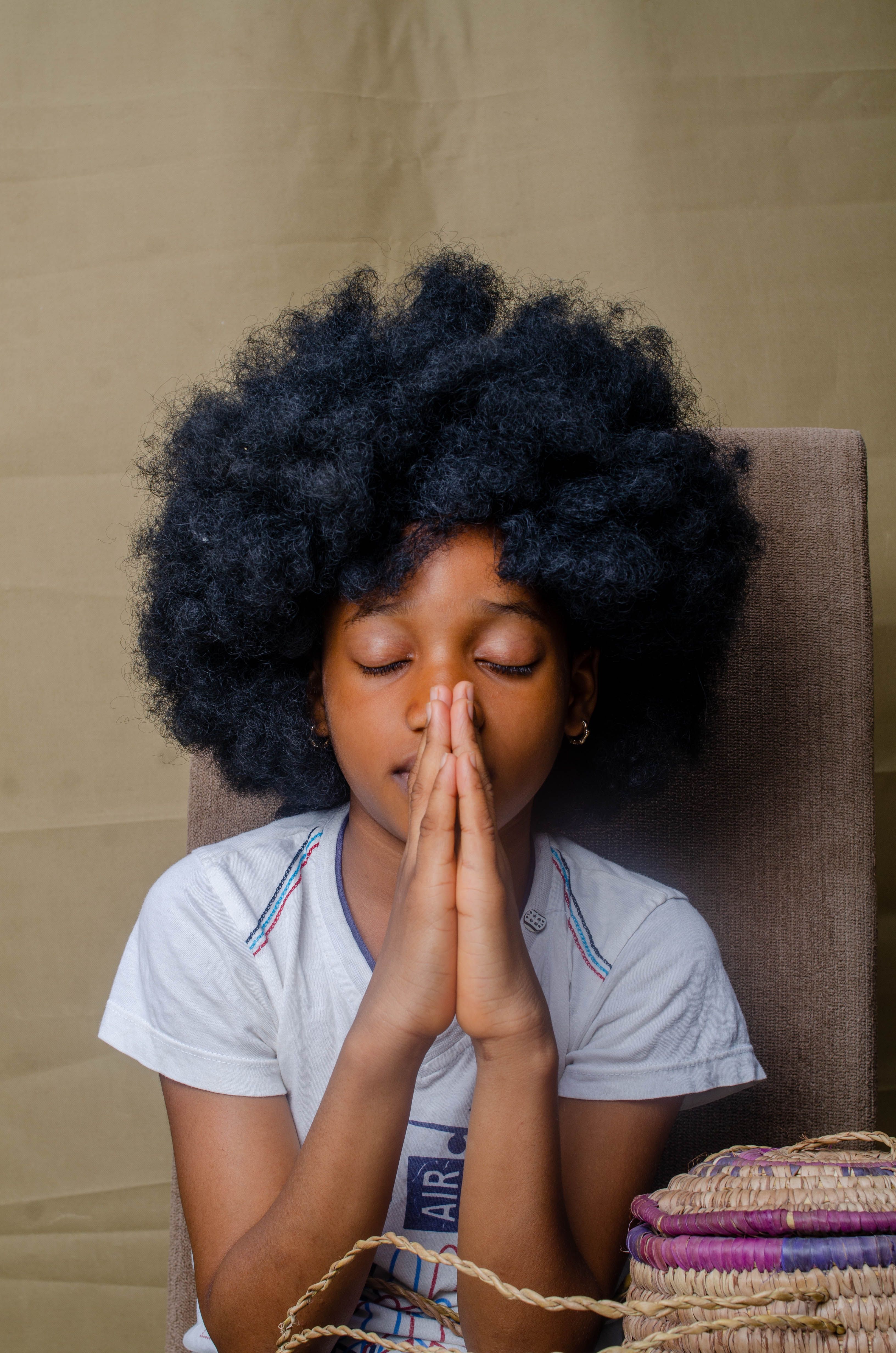 Teenage Girl Praying in Studio · Free Stock Photo