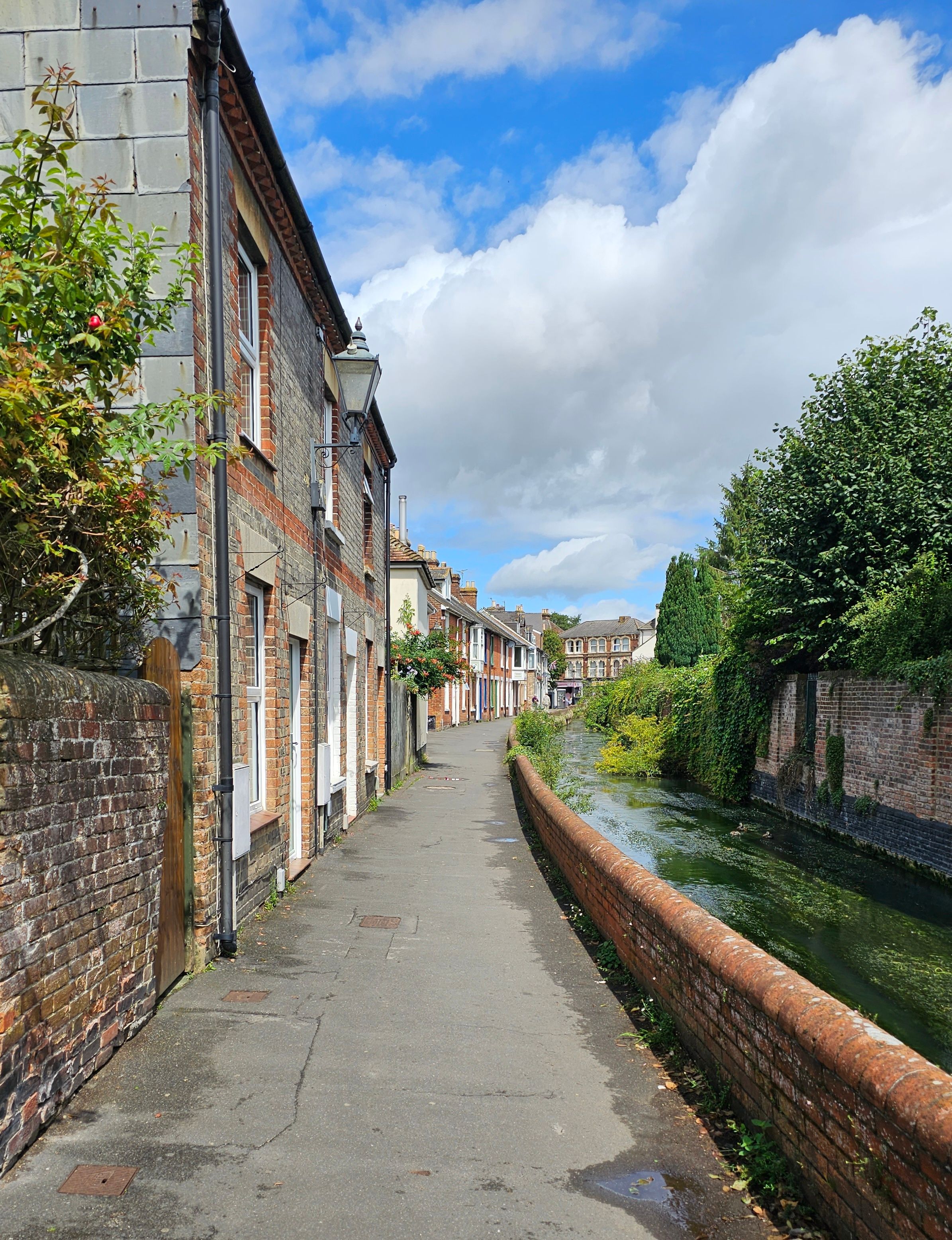 A Pavement between a Canal and Traditional Houses in a Town · Free ...