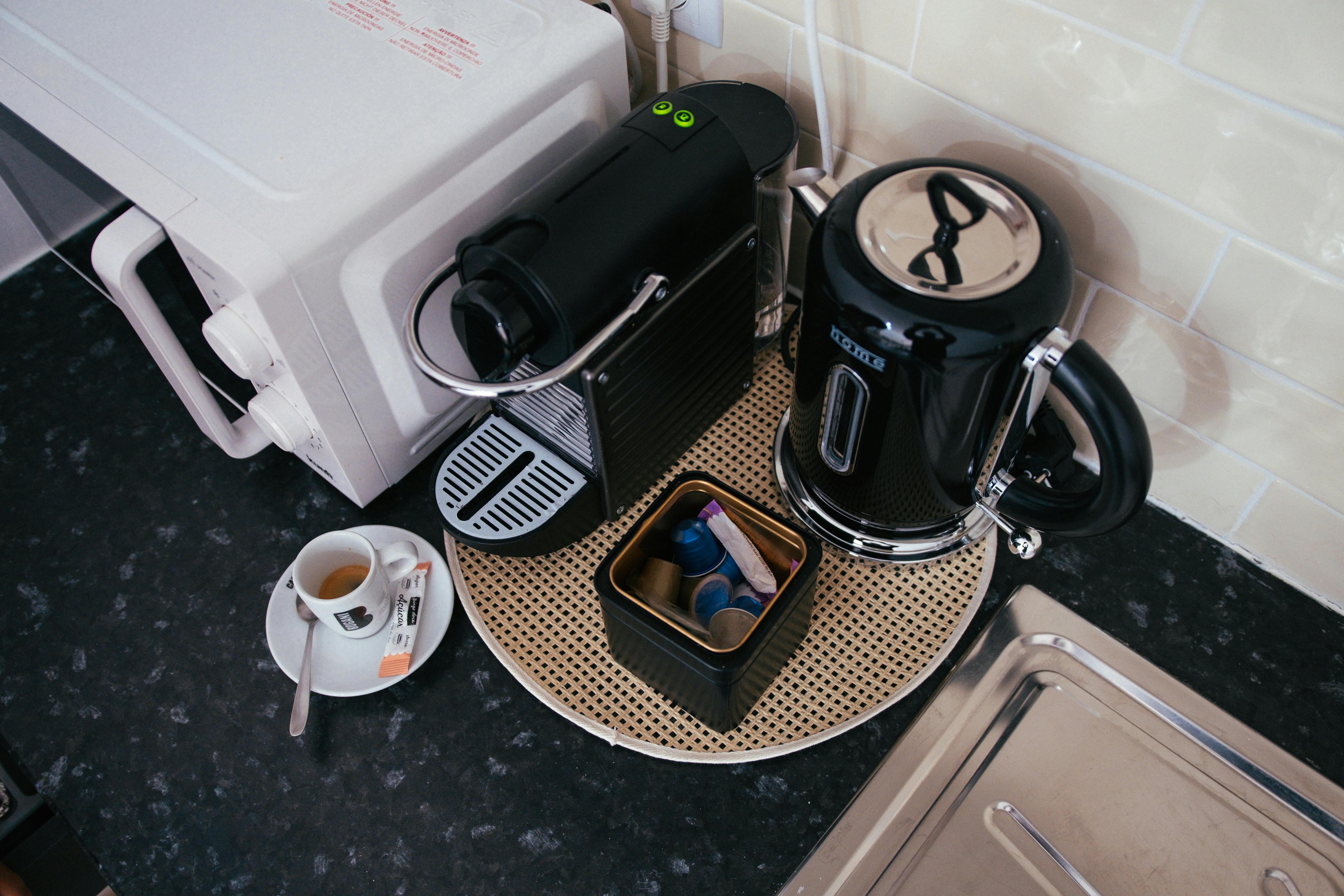 Top View of a Coffee Machine, a Kettle, and a Microwave · Free Stock Photo