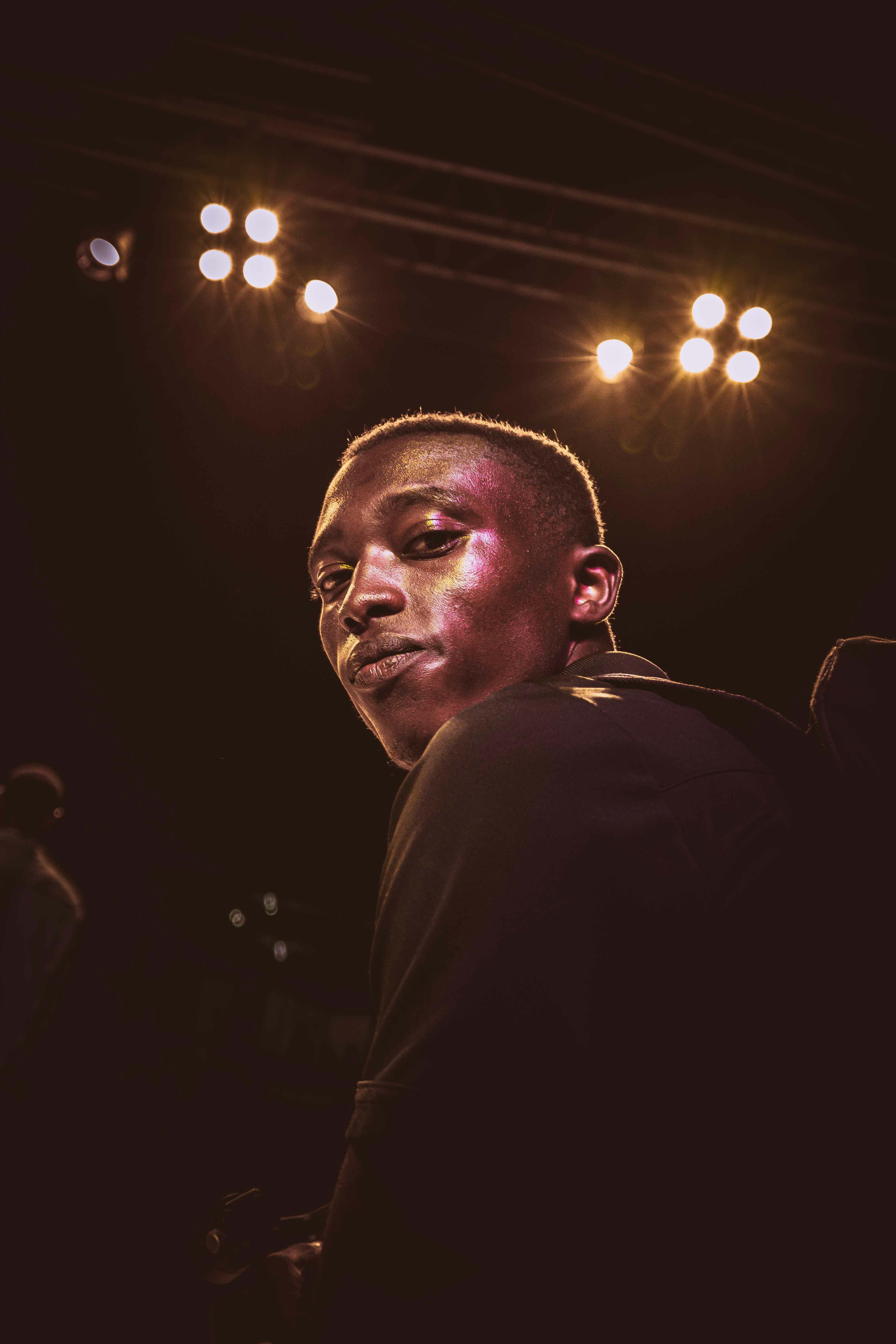 Man Looking Back over Shoulder in Camera · Free Stock Photo