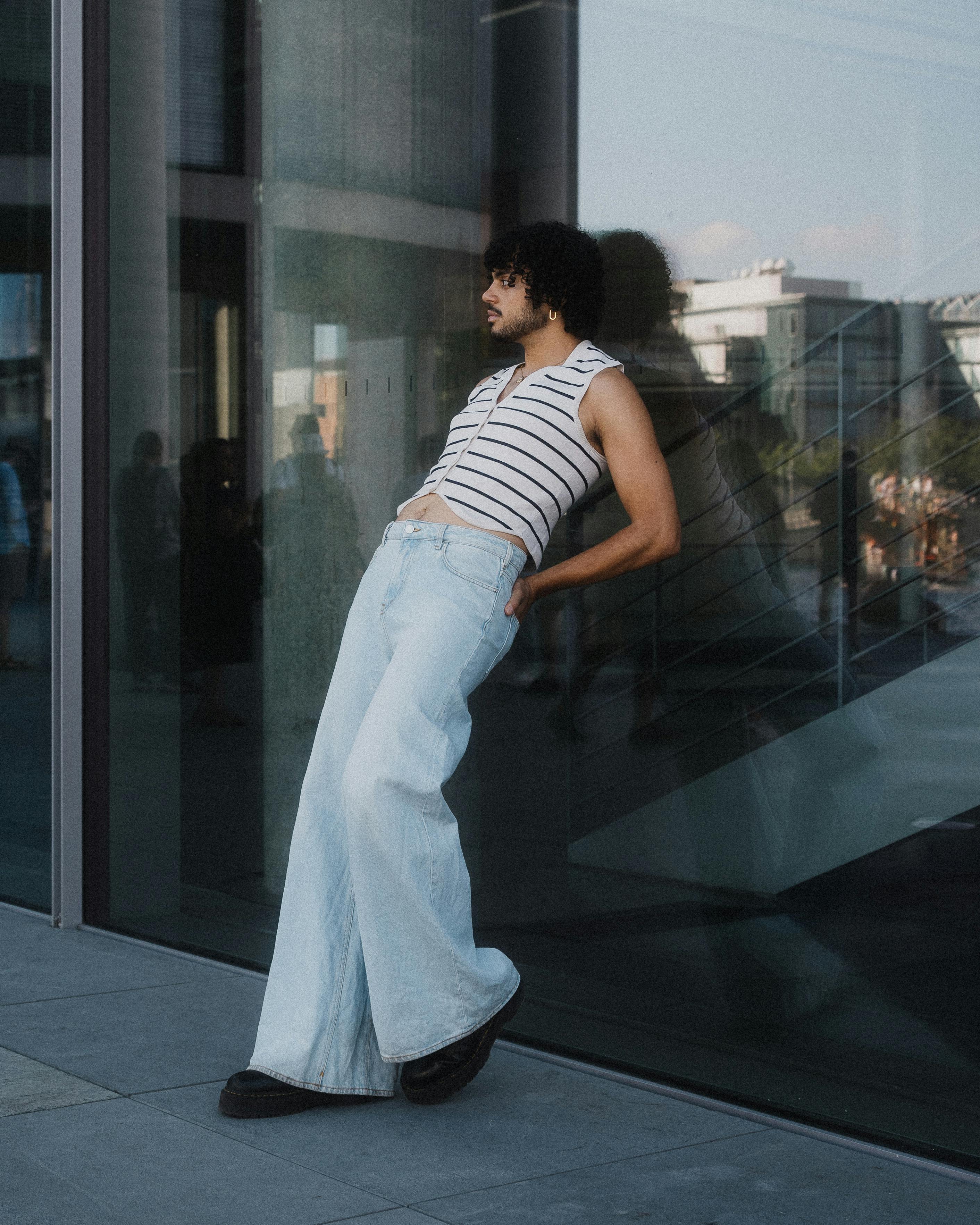 Man Posing by a Railing · Free Stock Photo