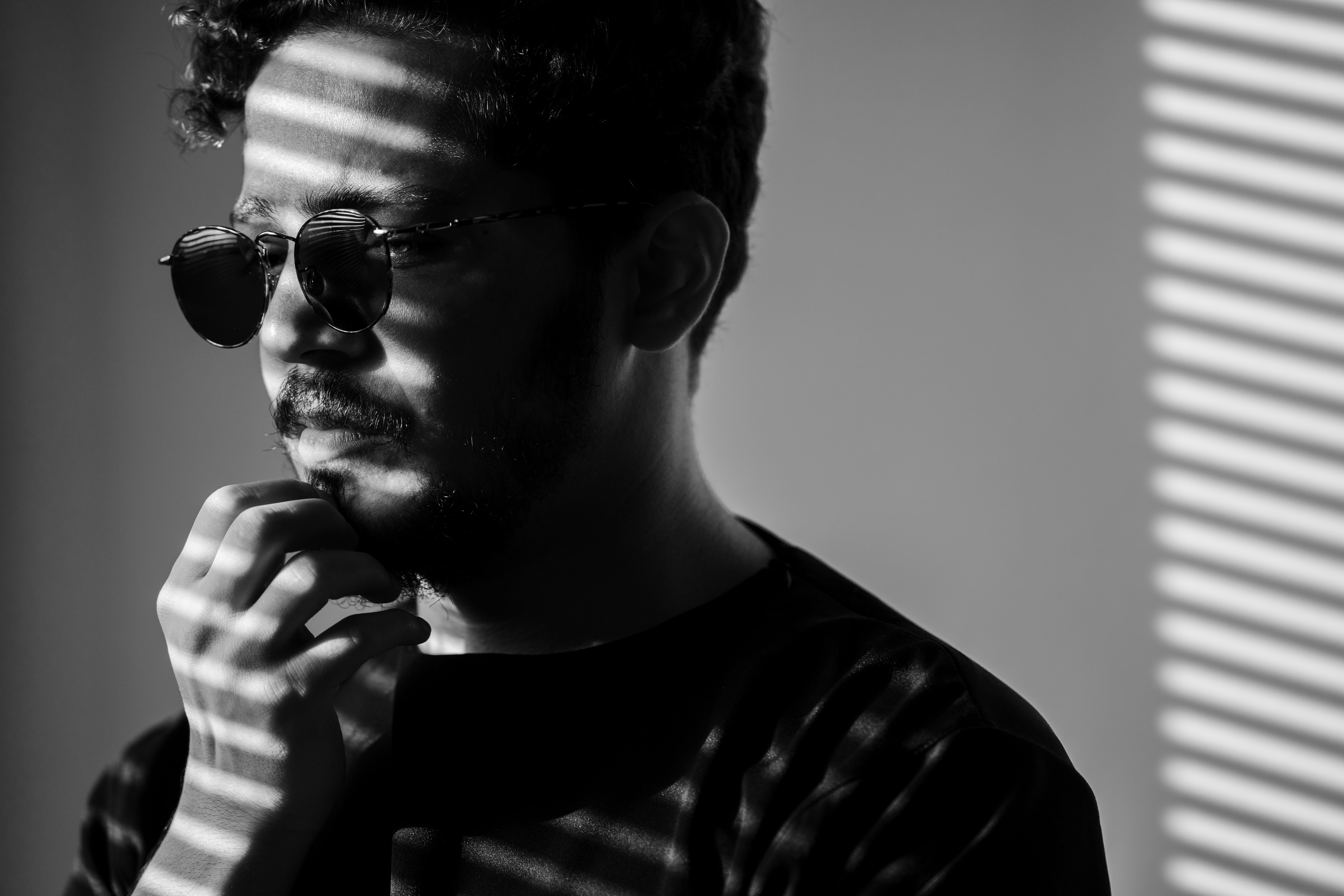 Pensive Man in Round Shades · Free Stock Photo