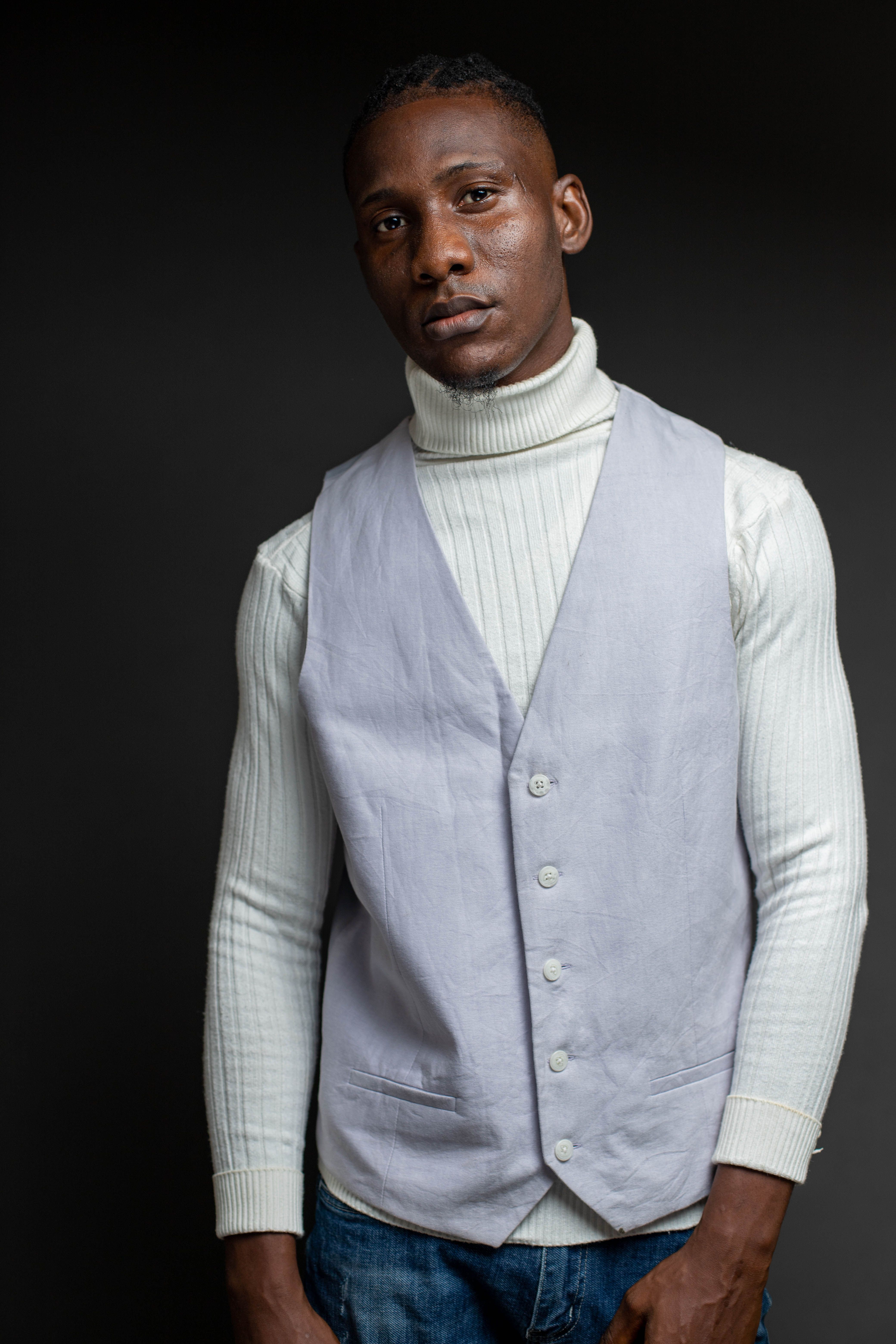 Model in White Turtleneck and Waistcoat · Free Stock Photo