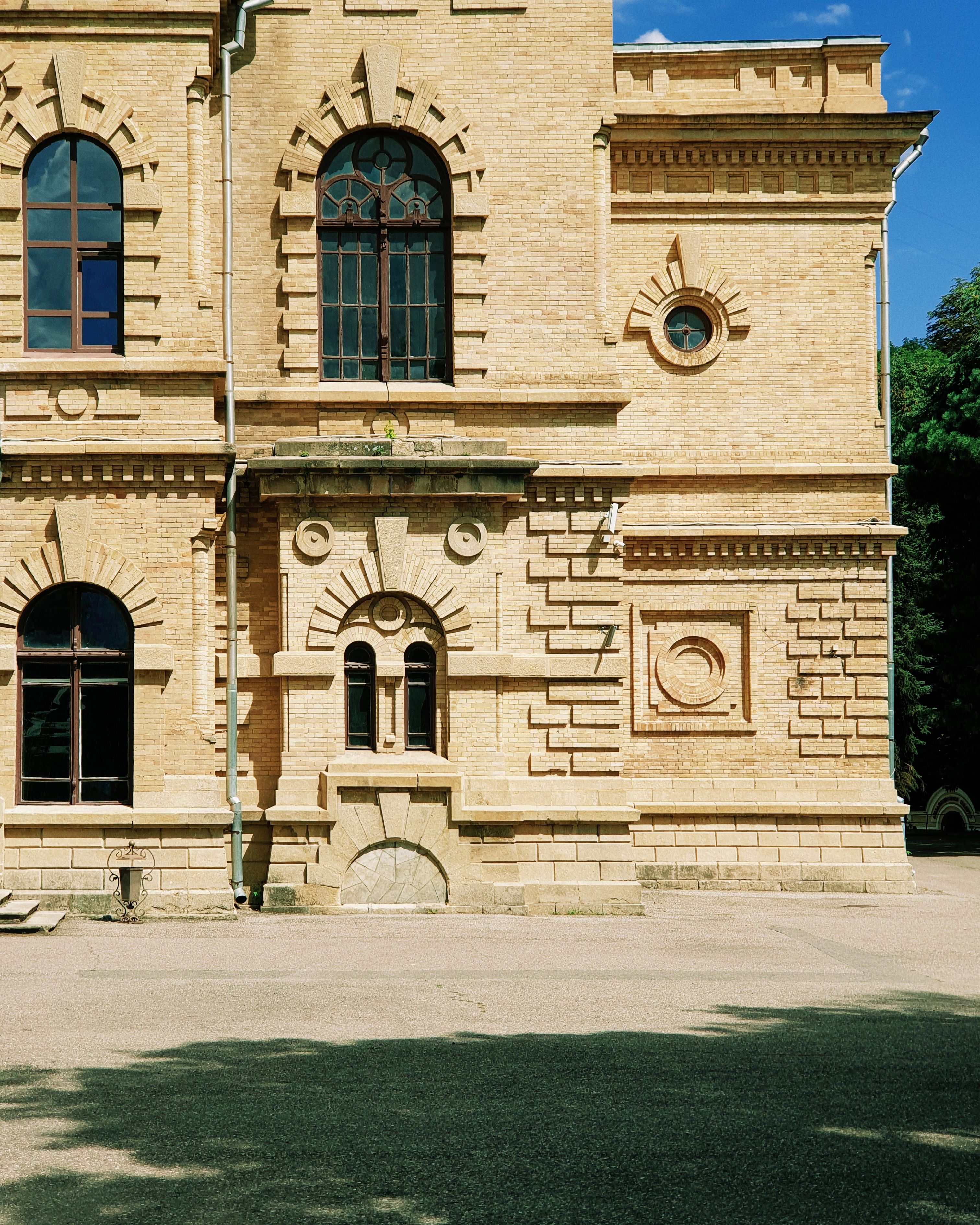 Exterior of an Antique Building with Carved Details · Free Stock Photo
