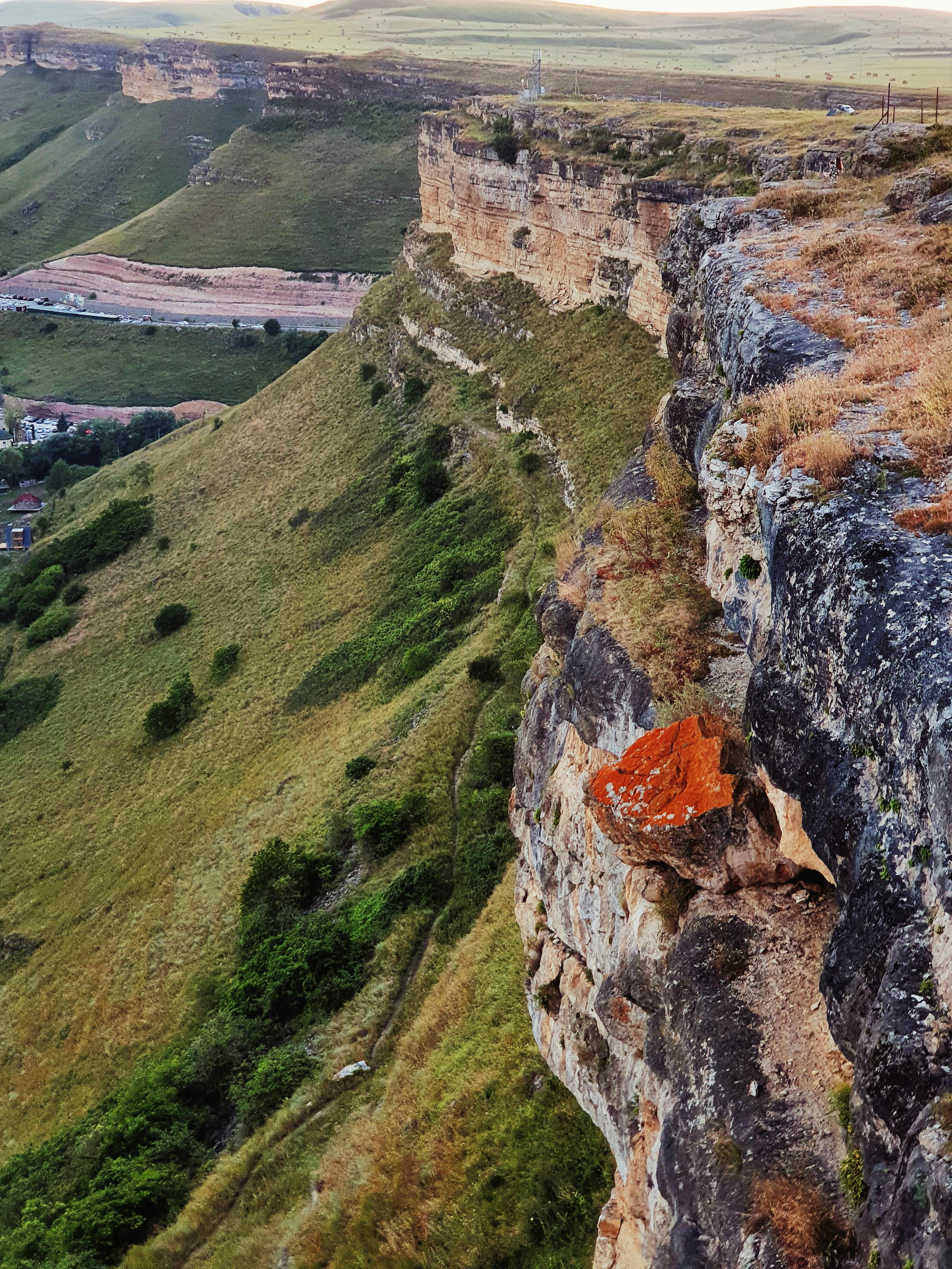 High Steep Hills with Grass on Them · Free Stock Photo