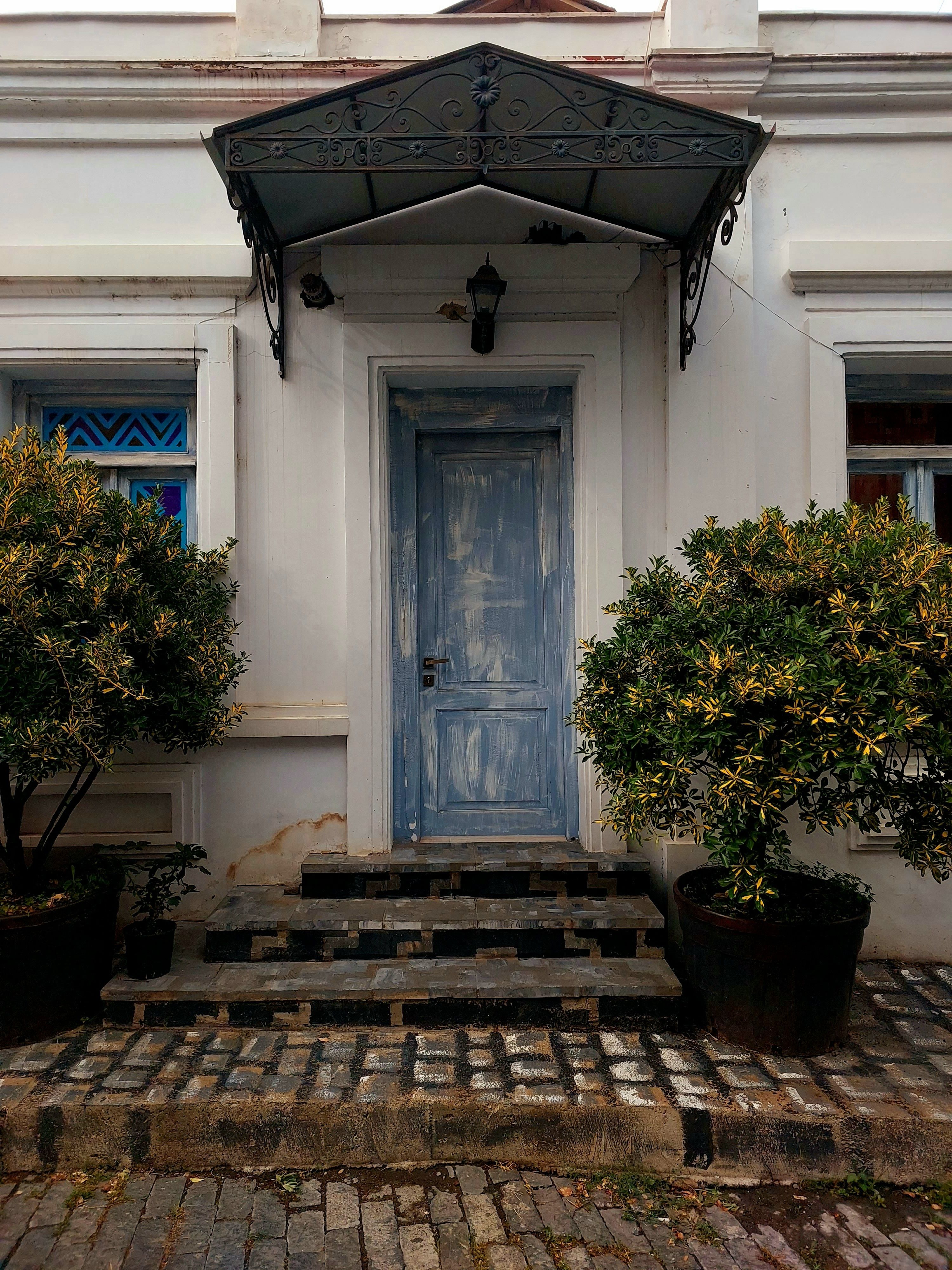 White Building Facade with Open Doors · Free Stock Photo