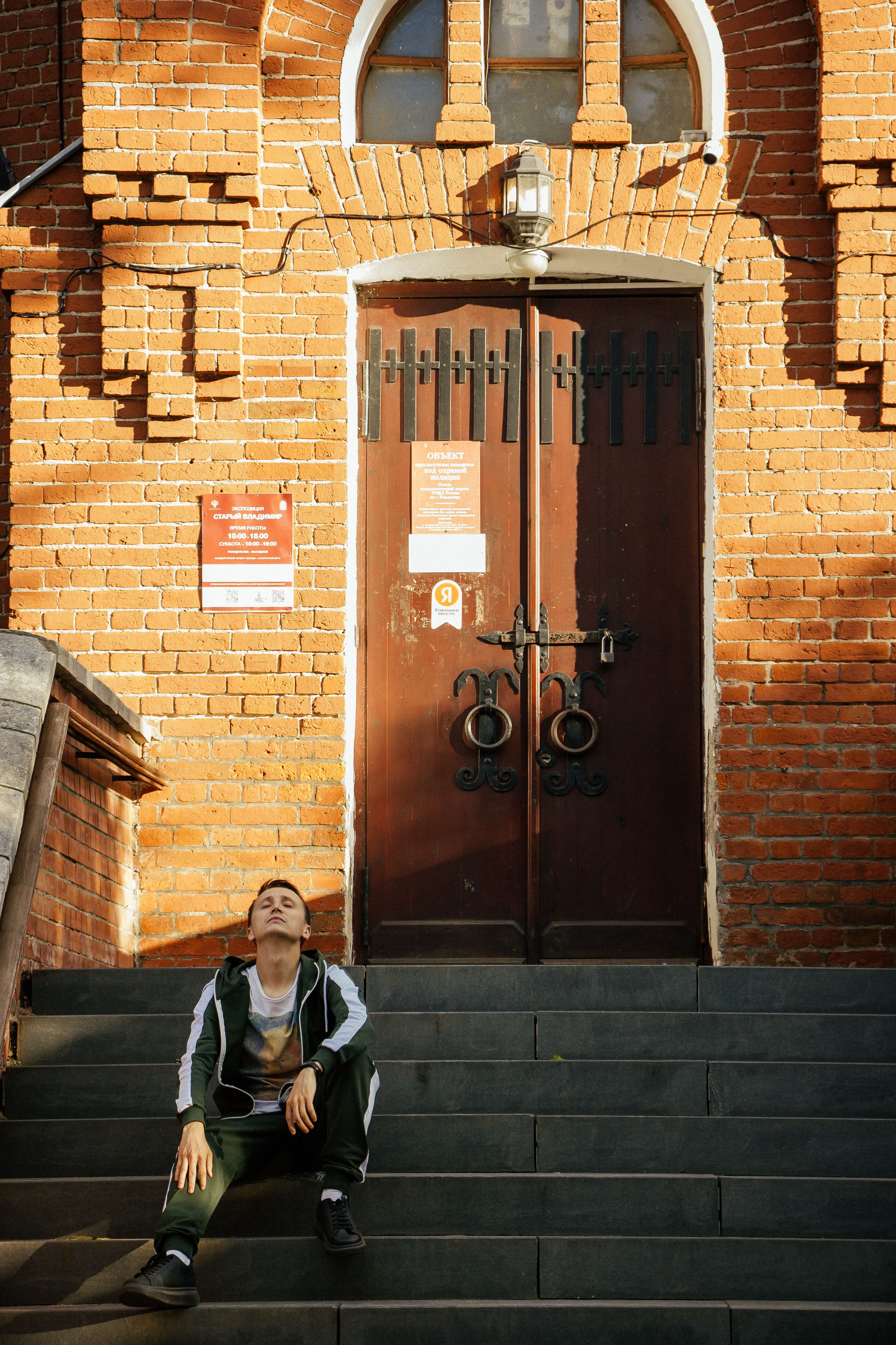 Casual Style Man Relaxing on Steps · Free Stock Photo