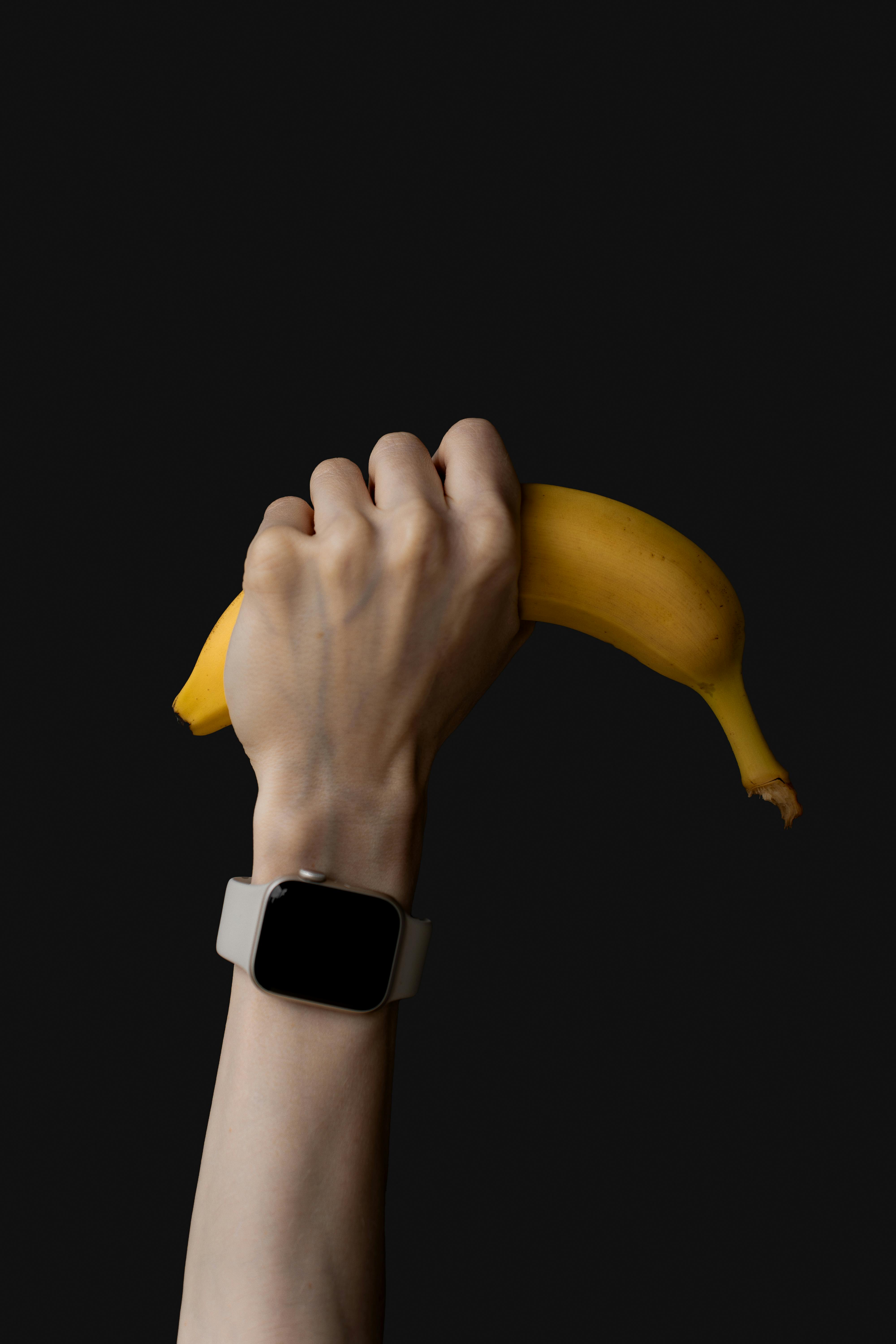 Hand Holding Banana · Free Stock Photo