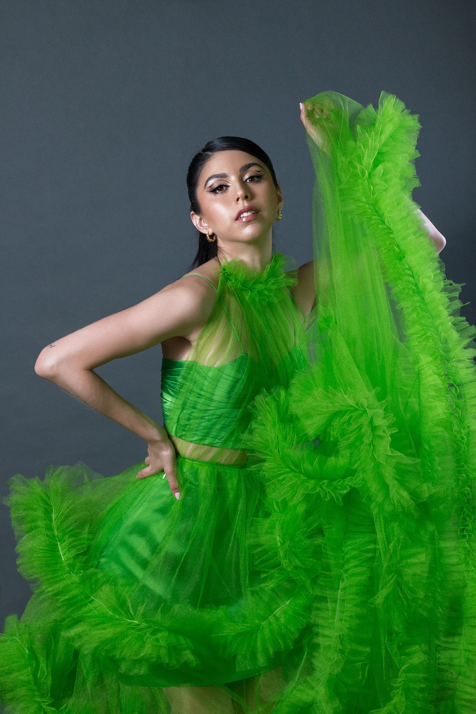 Woman Posing in a Green Dress · Free Stock Photo