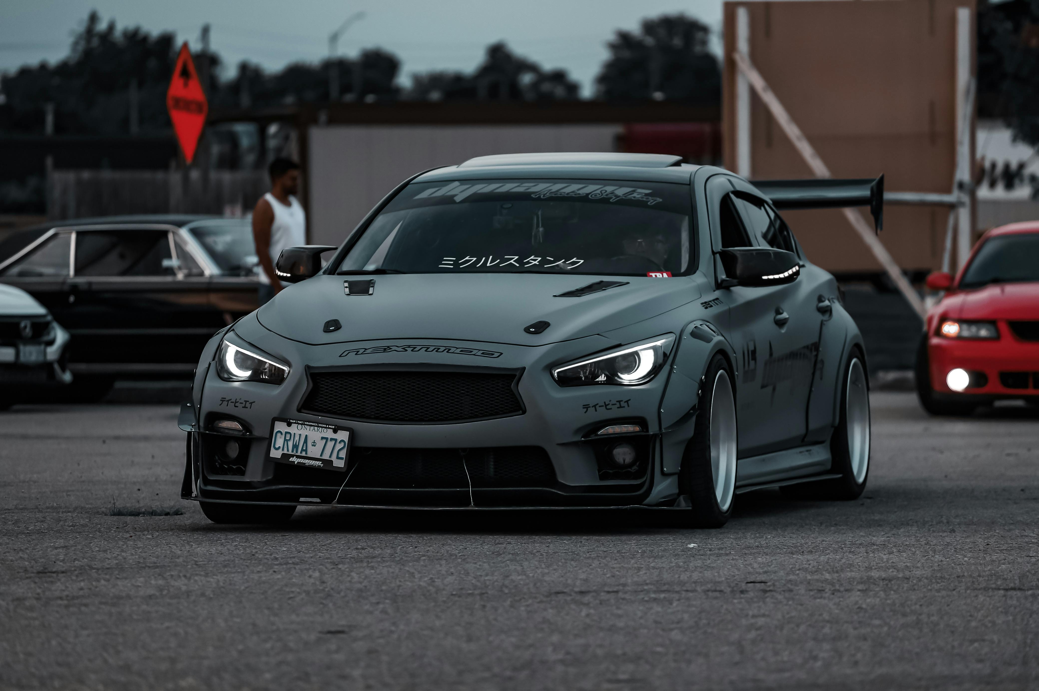 Infinity Sports Car on a Parking Lot · Free Stock Photo