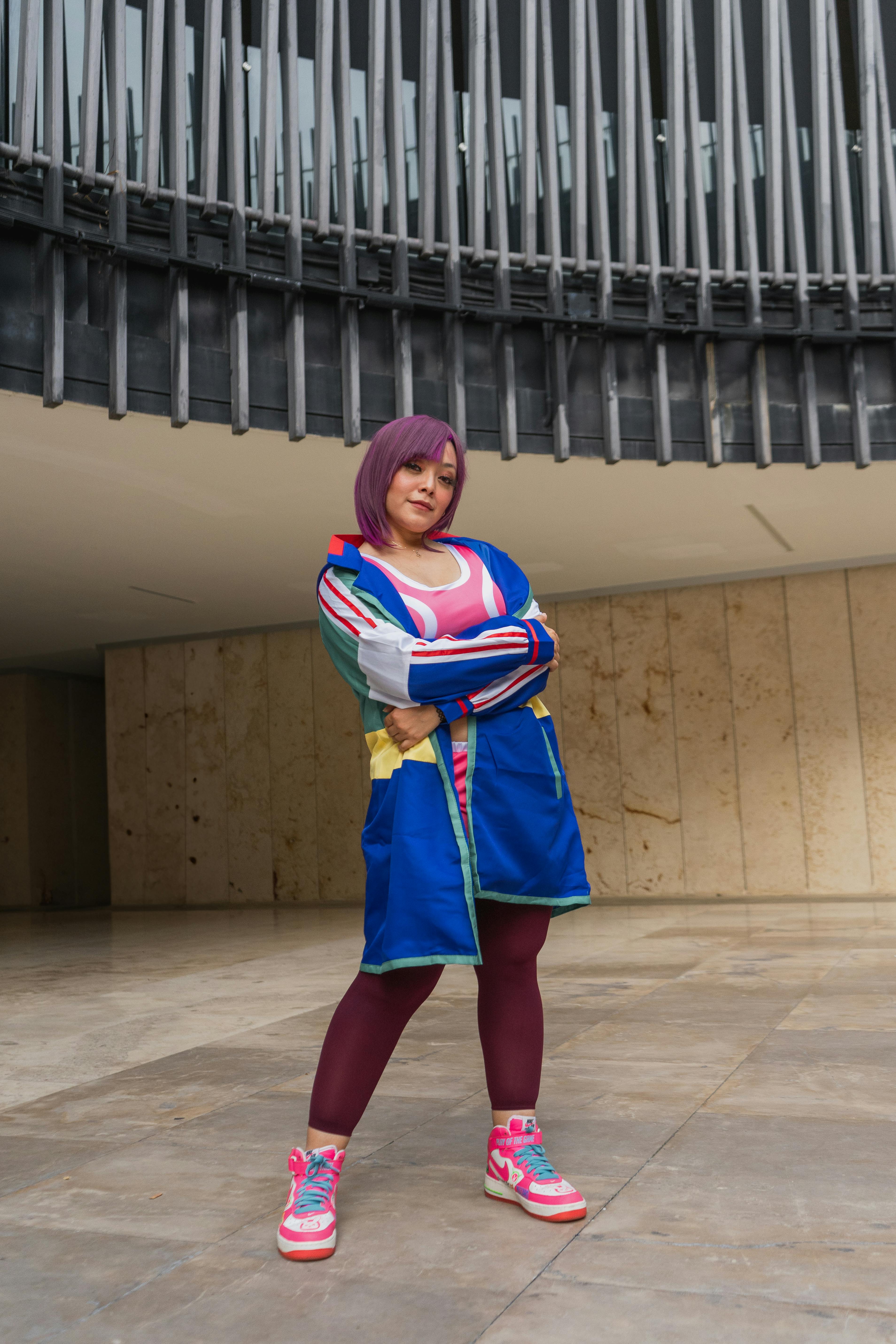 Woman Wearing Colorful Tracksuit on a Square · Free Stock Photo